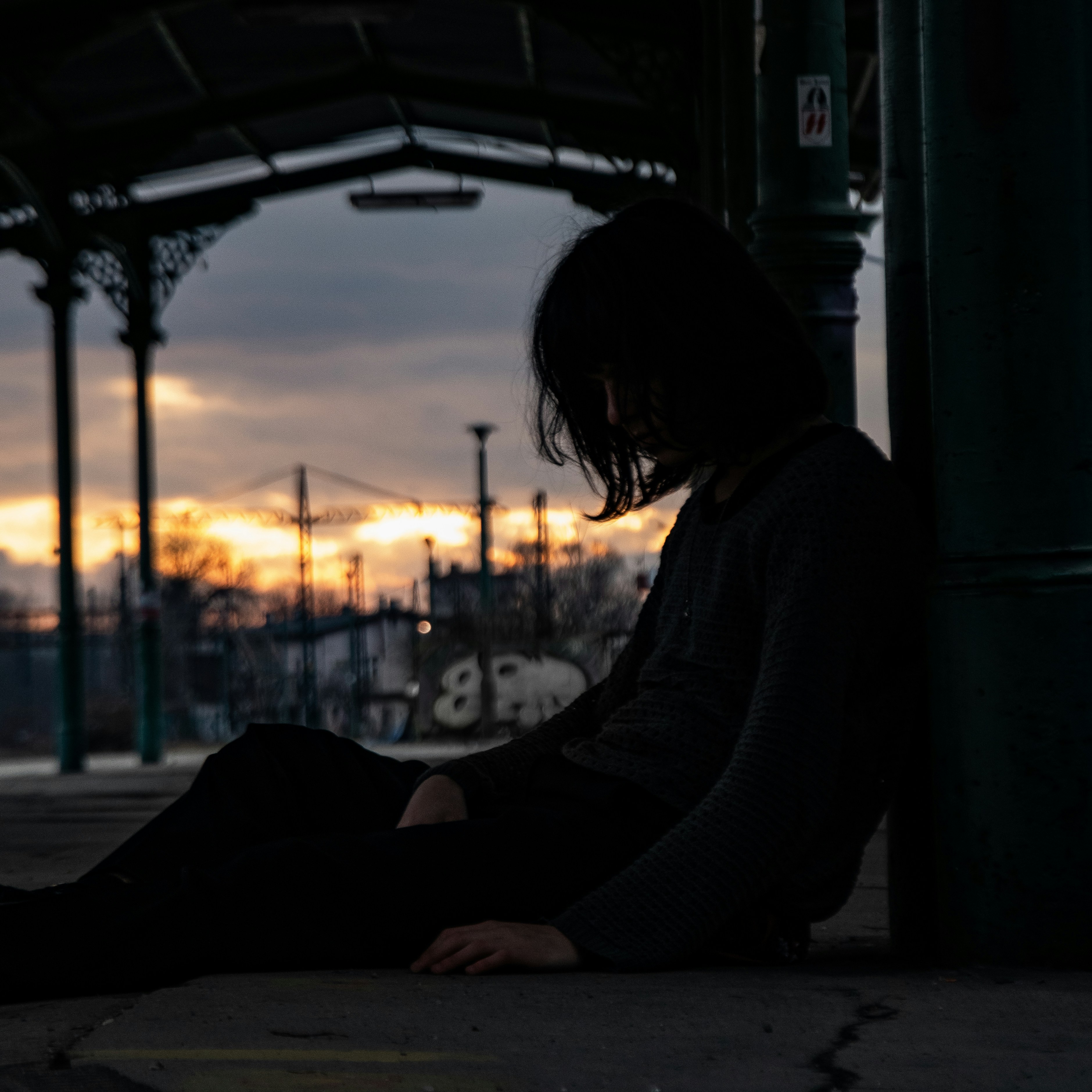 Evening Quiet Under the Pier: A silhouette at Dusk