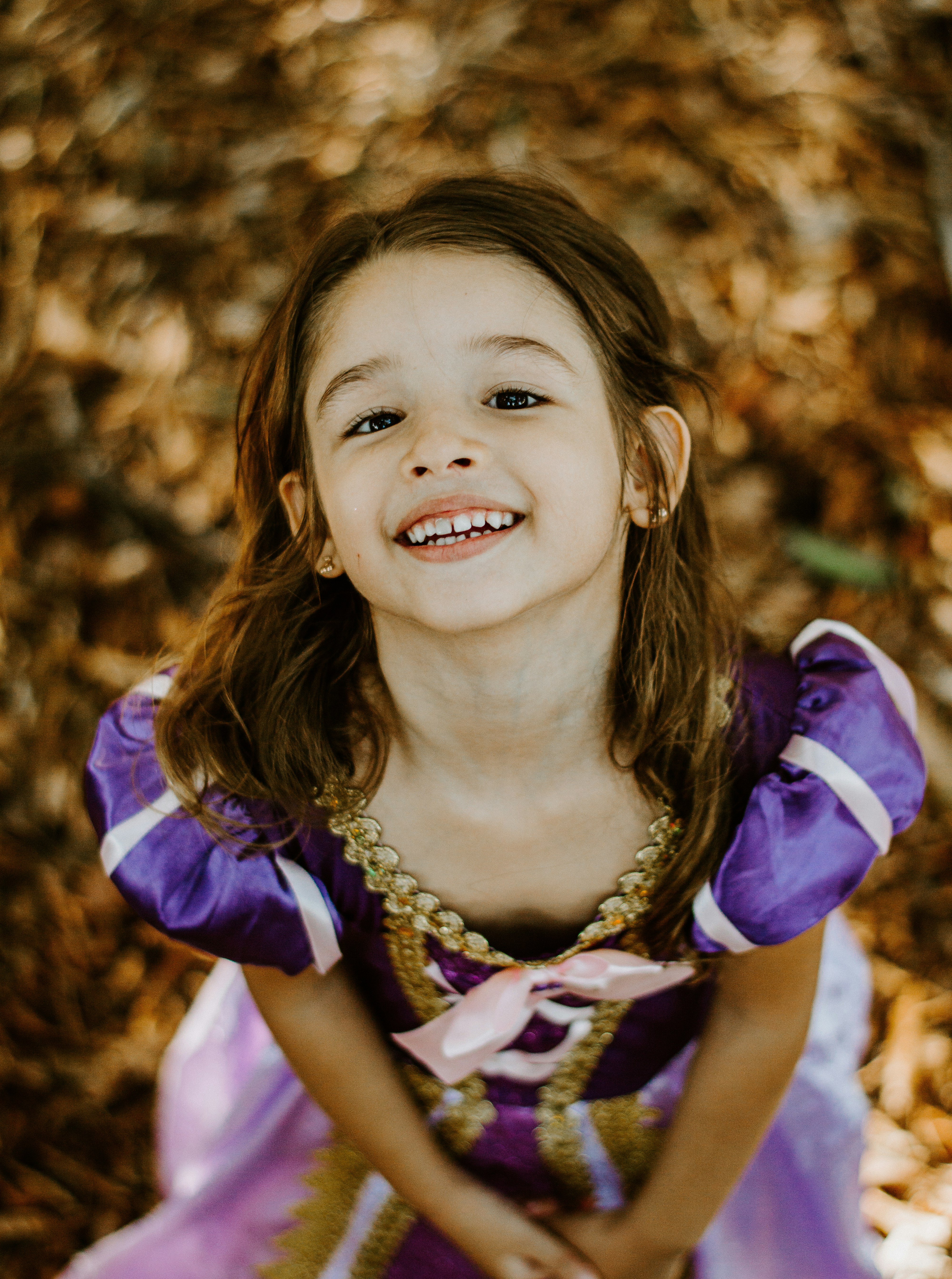 Girl in purple and yellow dress smiling photo – Free Girl Image on Unsplash