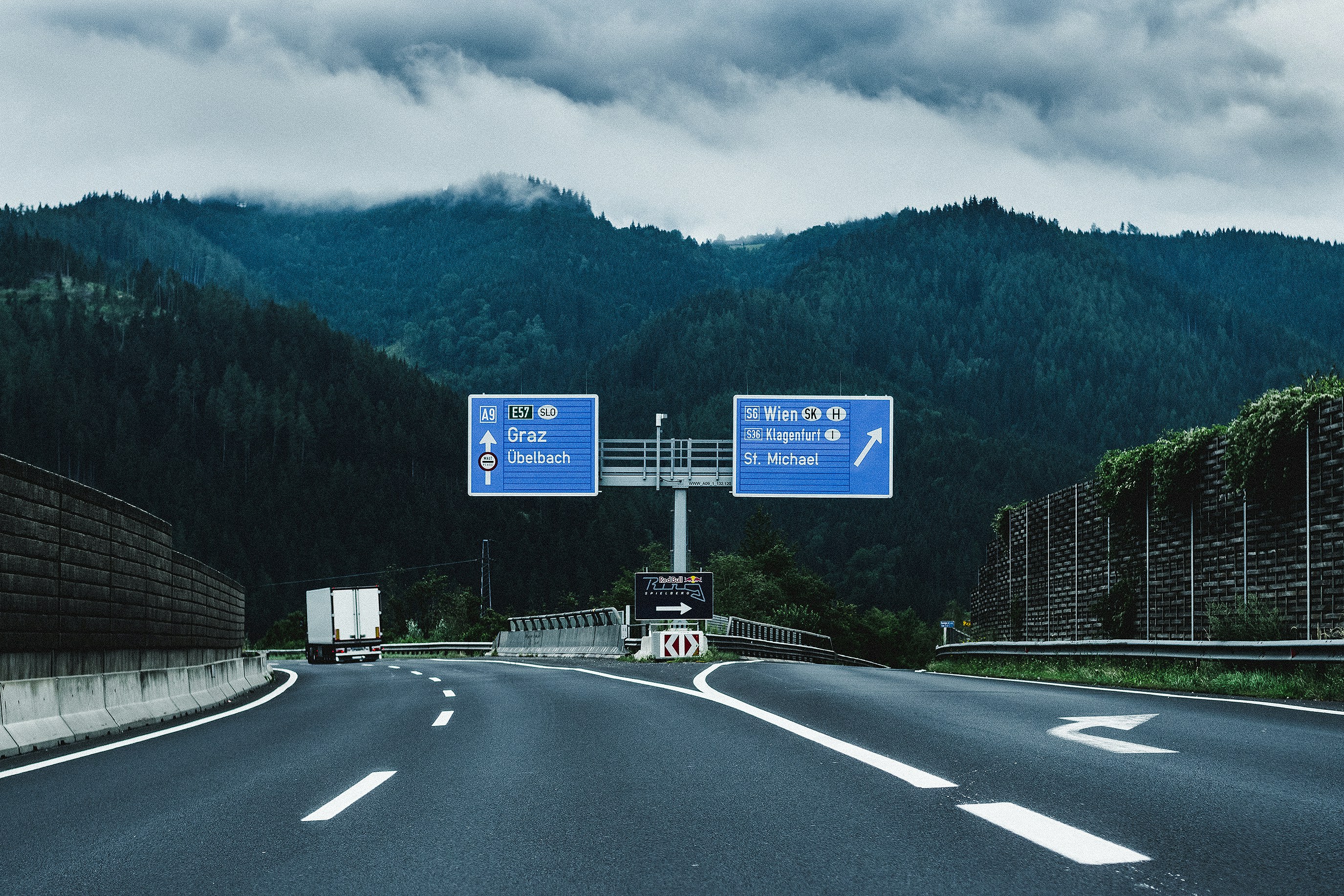 Blue and white road sign photo – Free Austria Image on Unsplash