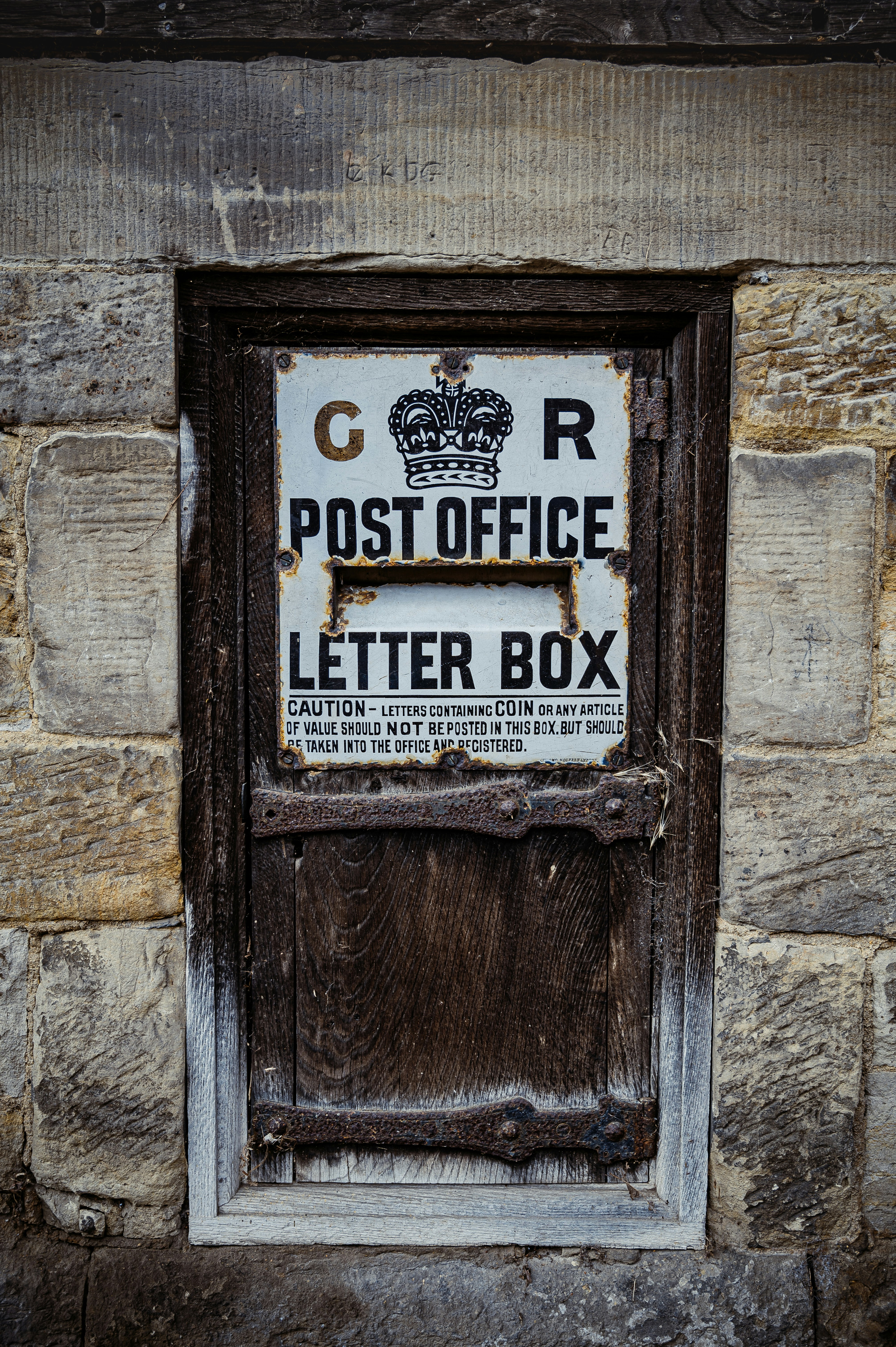 Old English postbox. | brown wooden framed white and black wooden wall decor