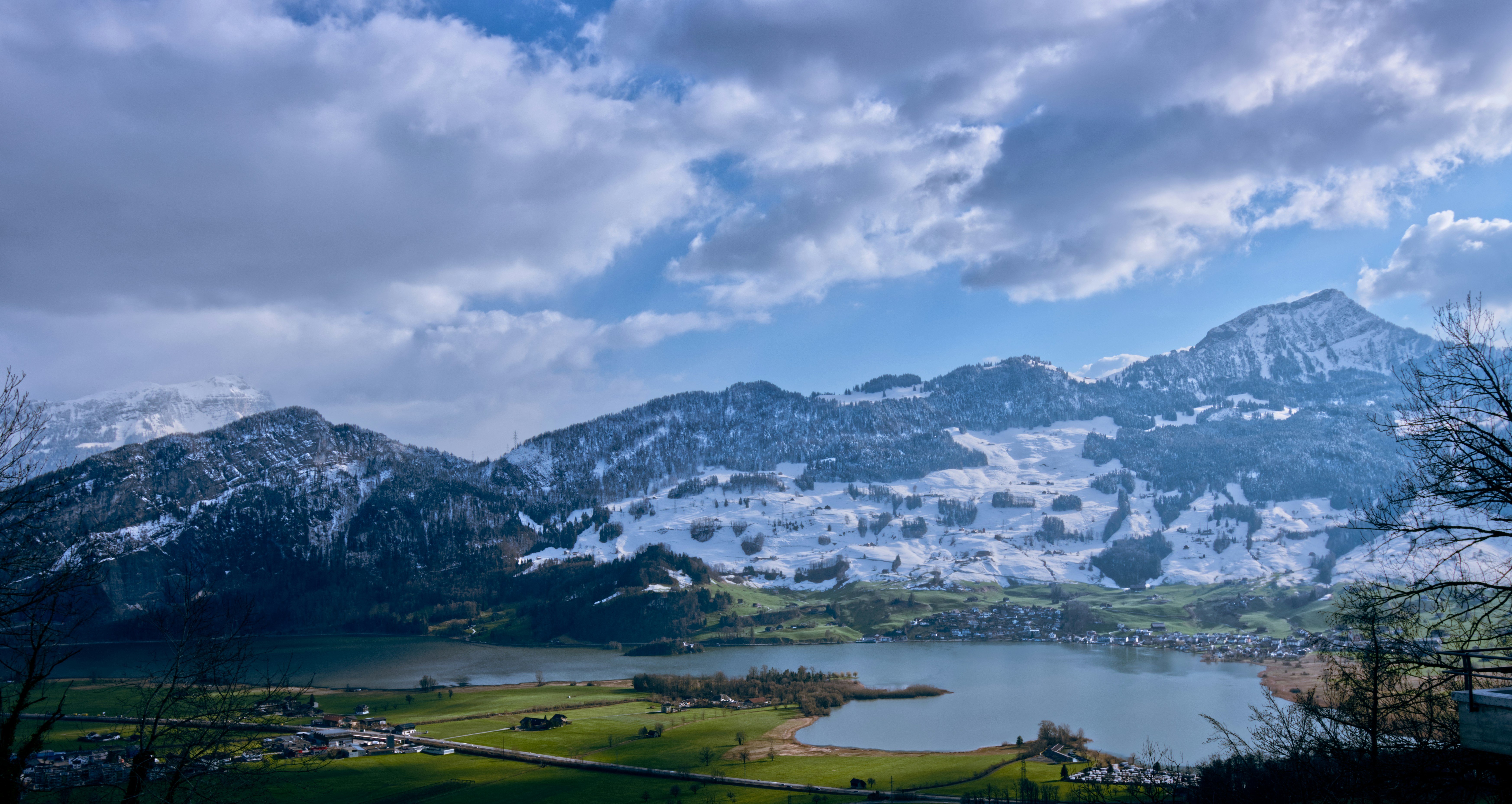 Serene Alpine Panorama Under Dynamic Skies