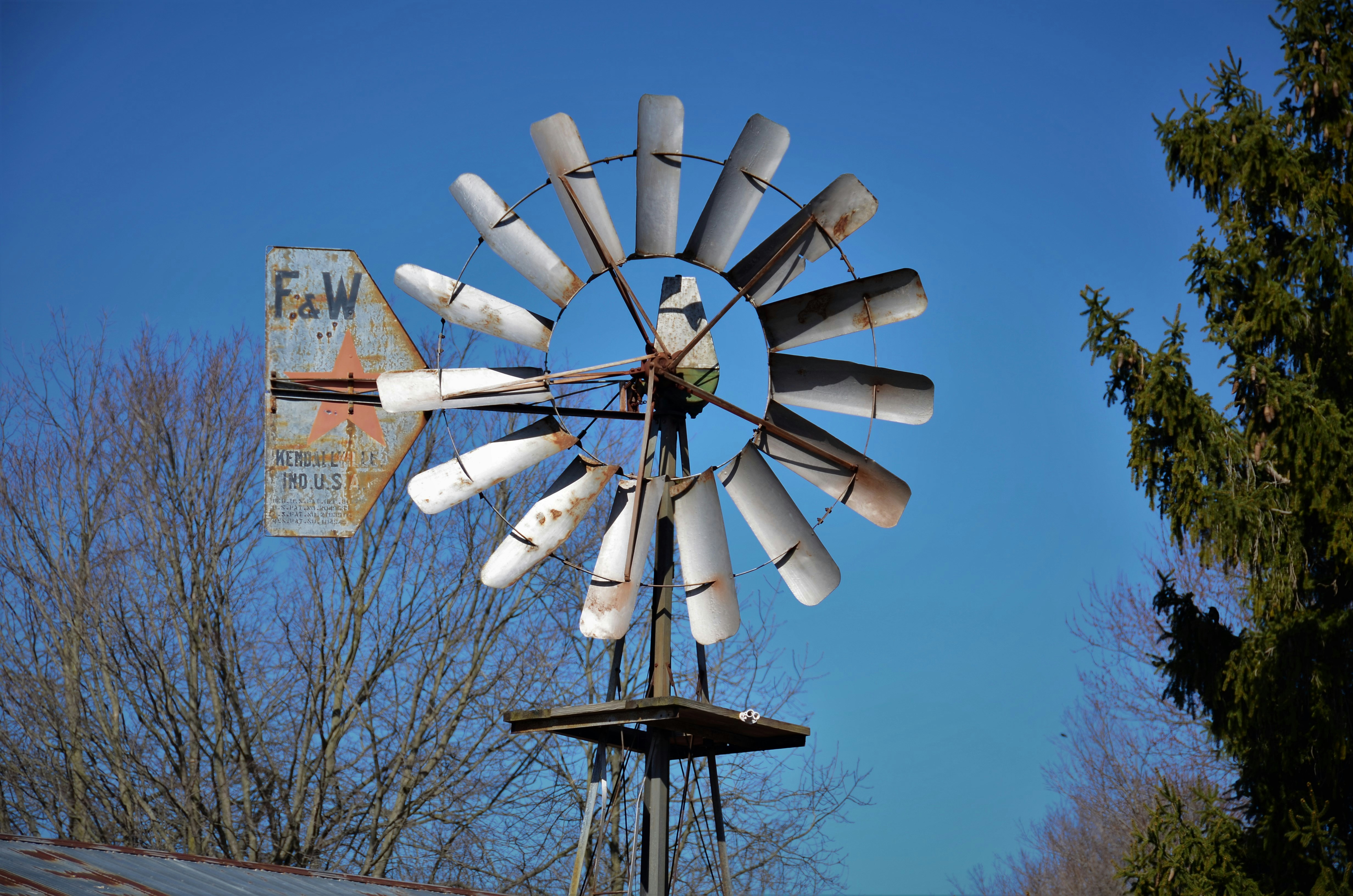 Old faded farm windmill