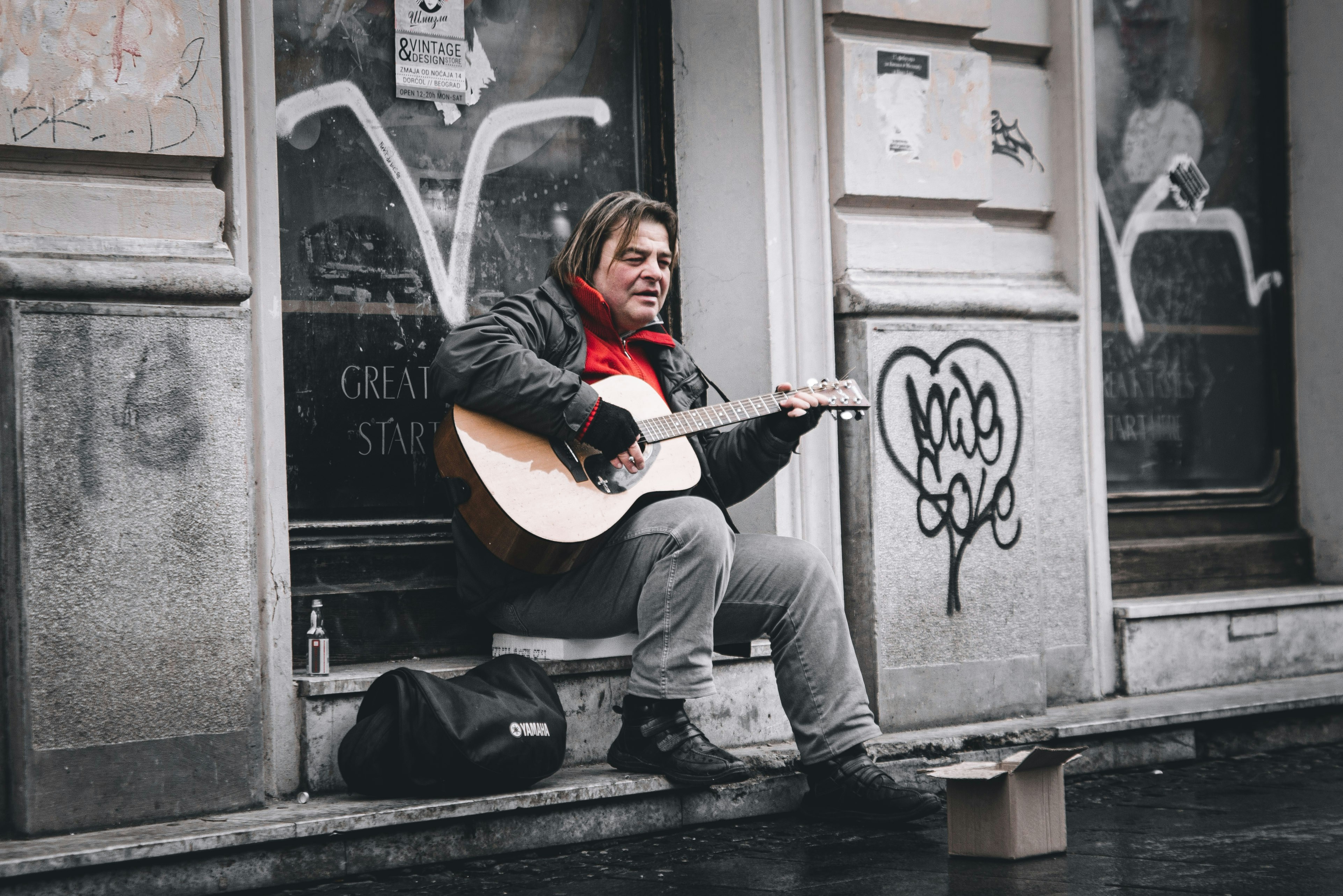 Harmonics at the Threshold: A Street Musician Among Graffiti and Concrete