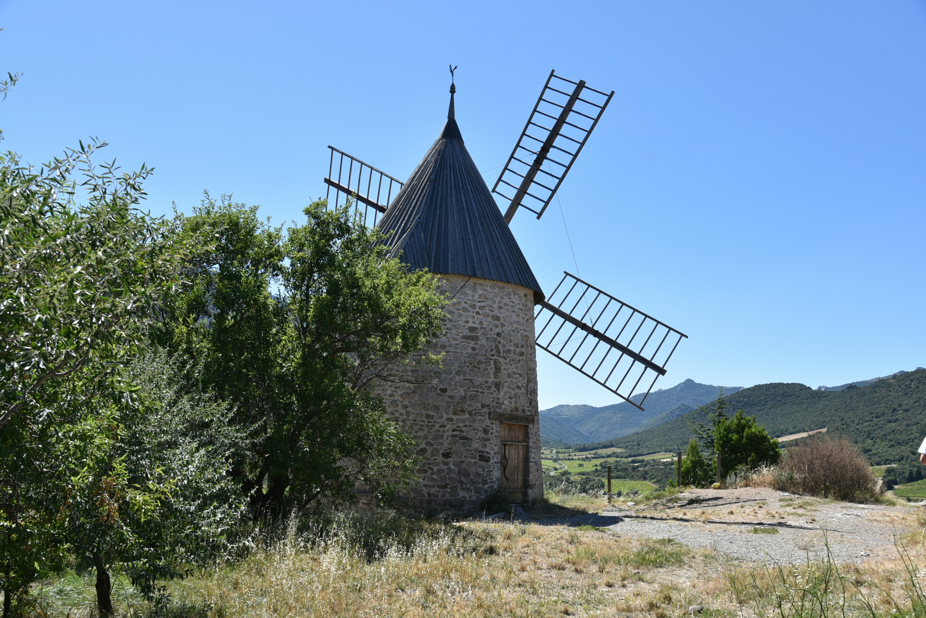 Stone Windmill in Sunlit Field