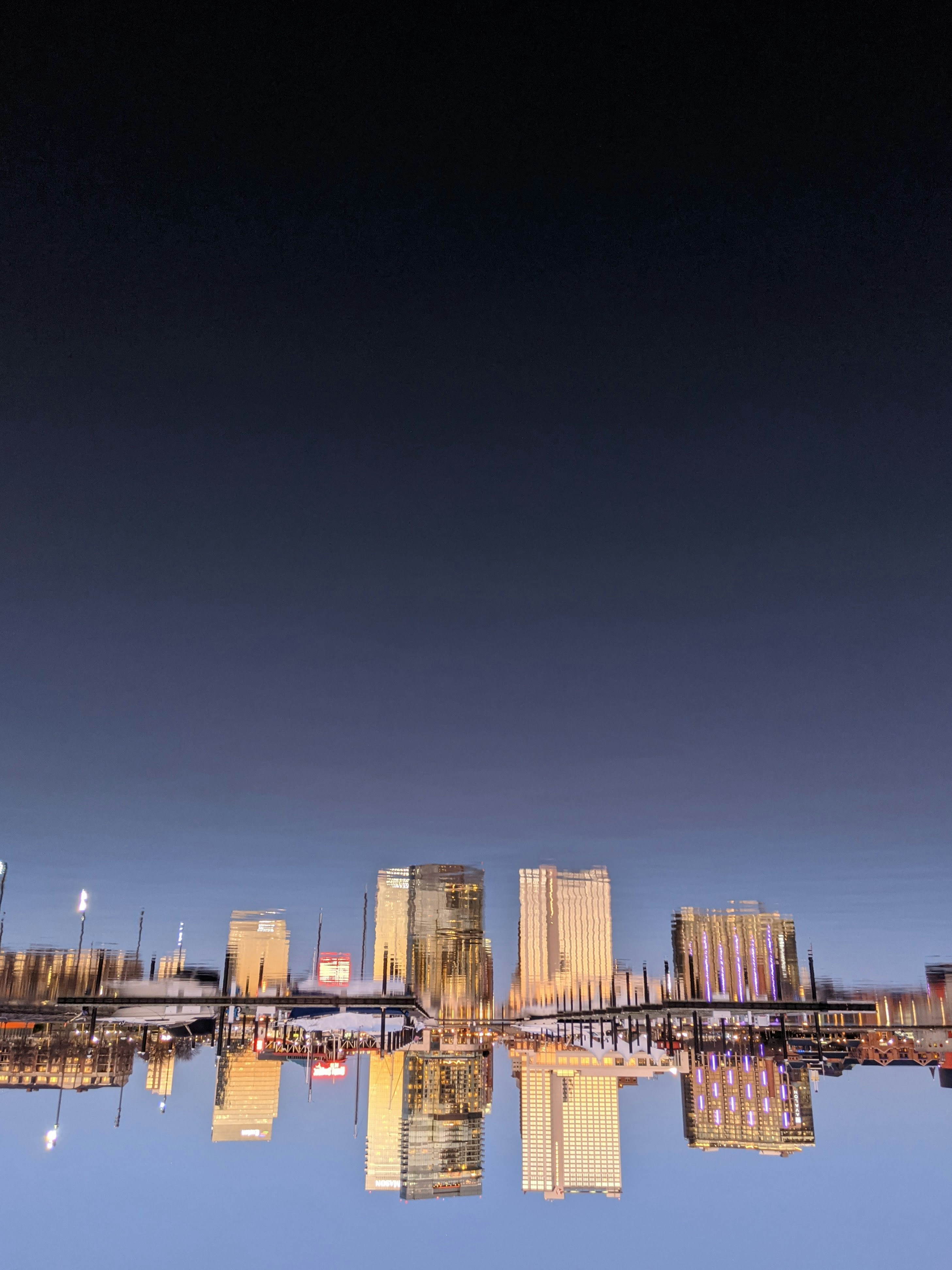 City Reflections: Twin Towers Rising Over the Quiet Harbor