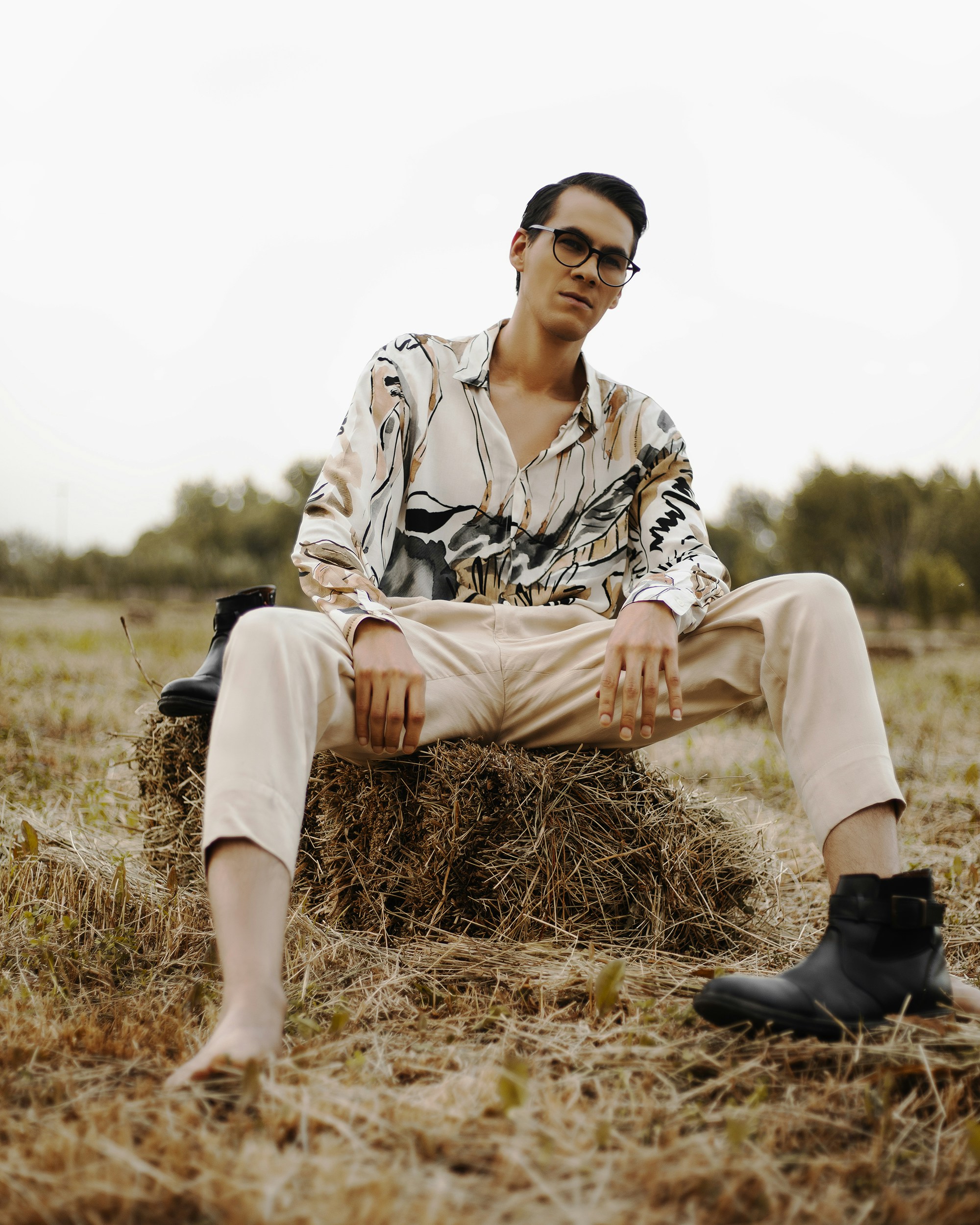 Field-Side Confidence: A Contemporary Portrait on Hay Bales