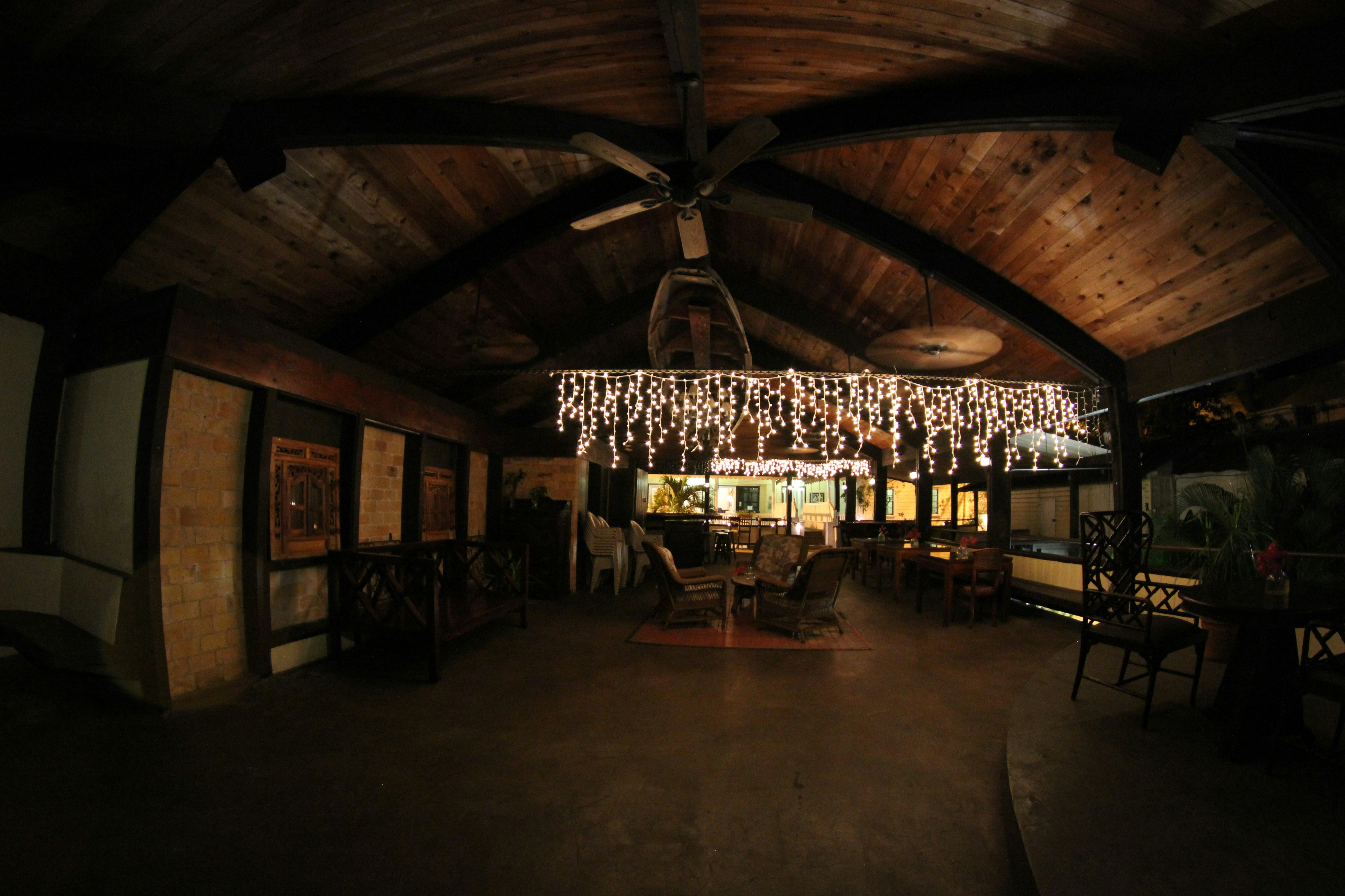 Chamber of Warm Lights: Cozy Dining Hall Under Wooden Arches
