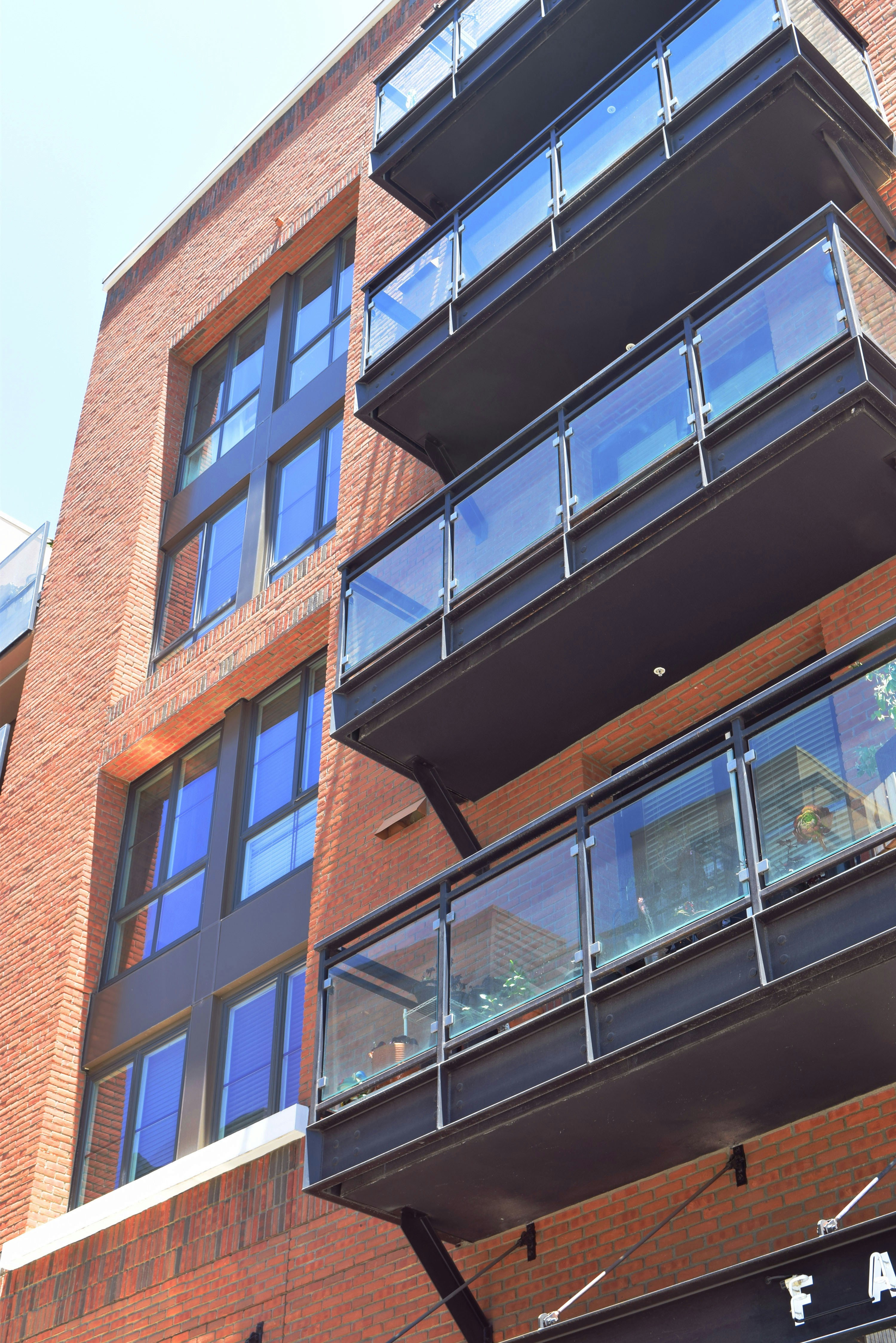 Balconies in Brick: Modern Urban Facade Crossing from Ground to Sky