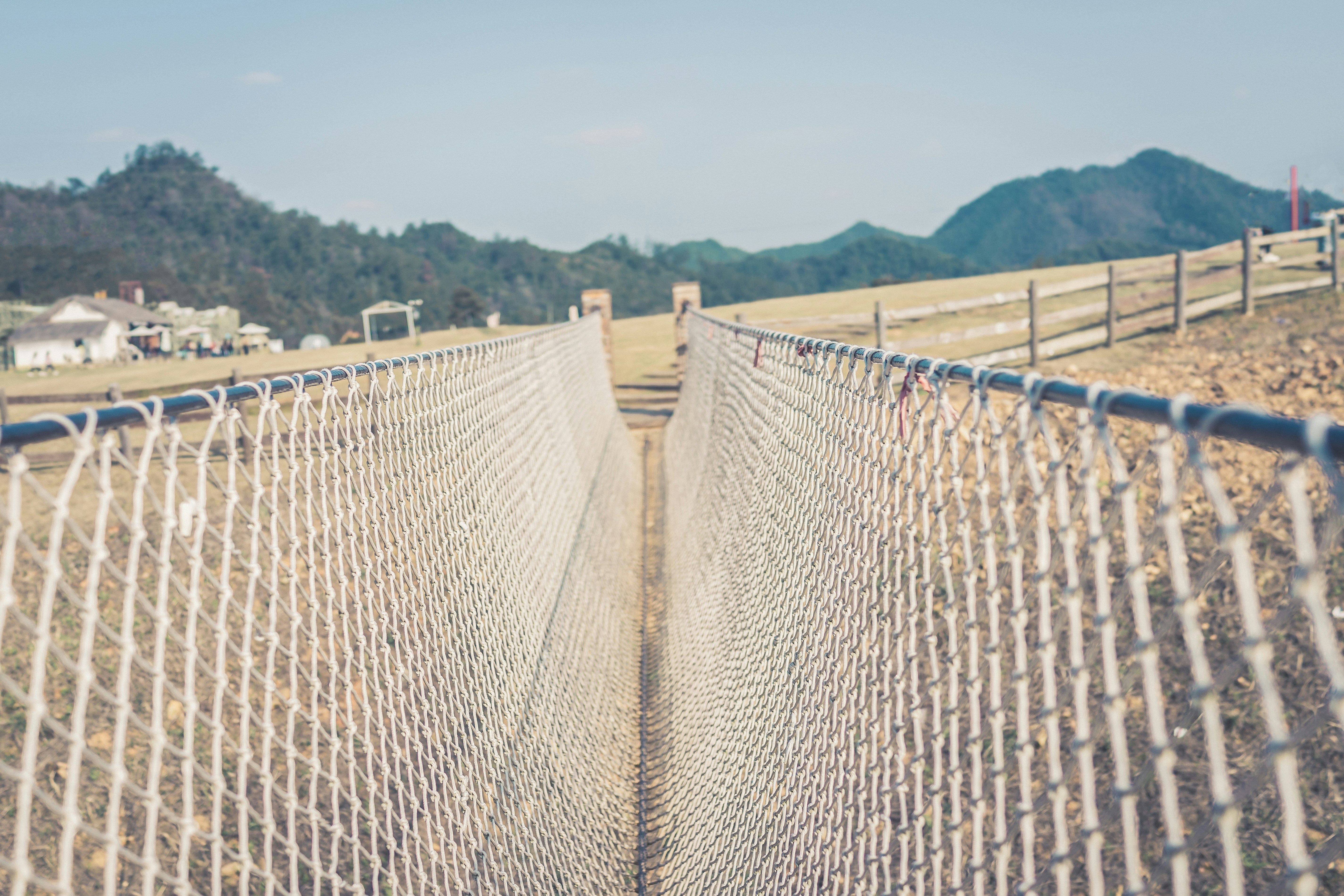 Between Rails: A Horizon of Fences and Hills