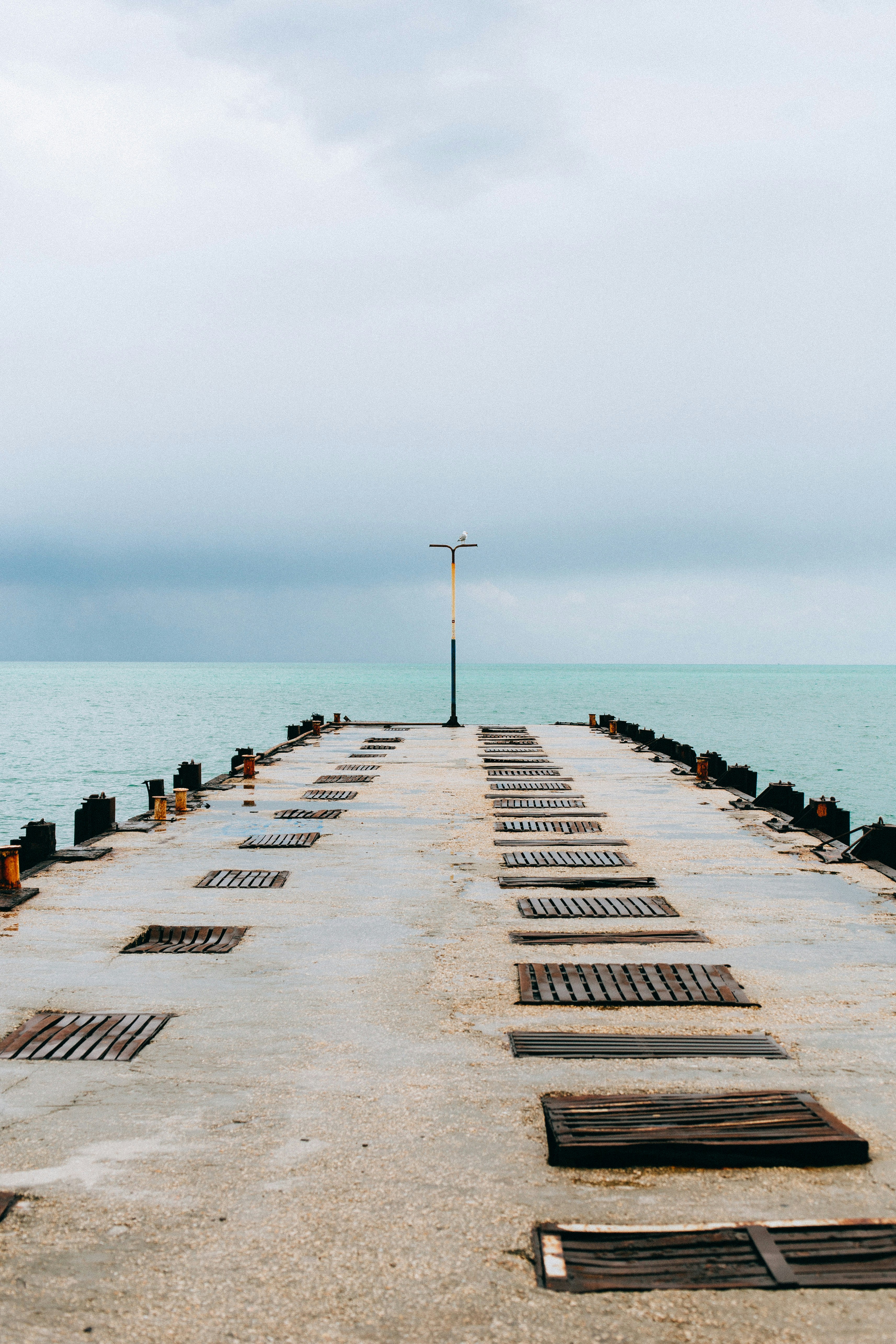 Beacon at the Pier's End: A Quiet Reach Toward the Sea
