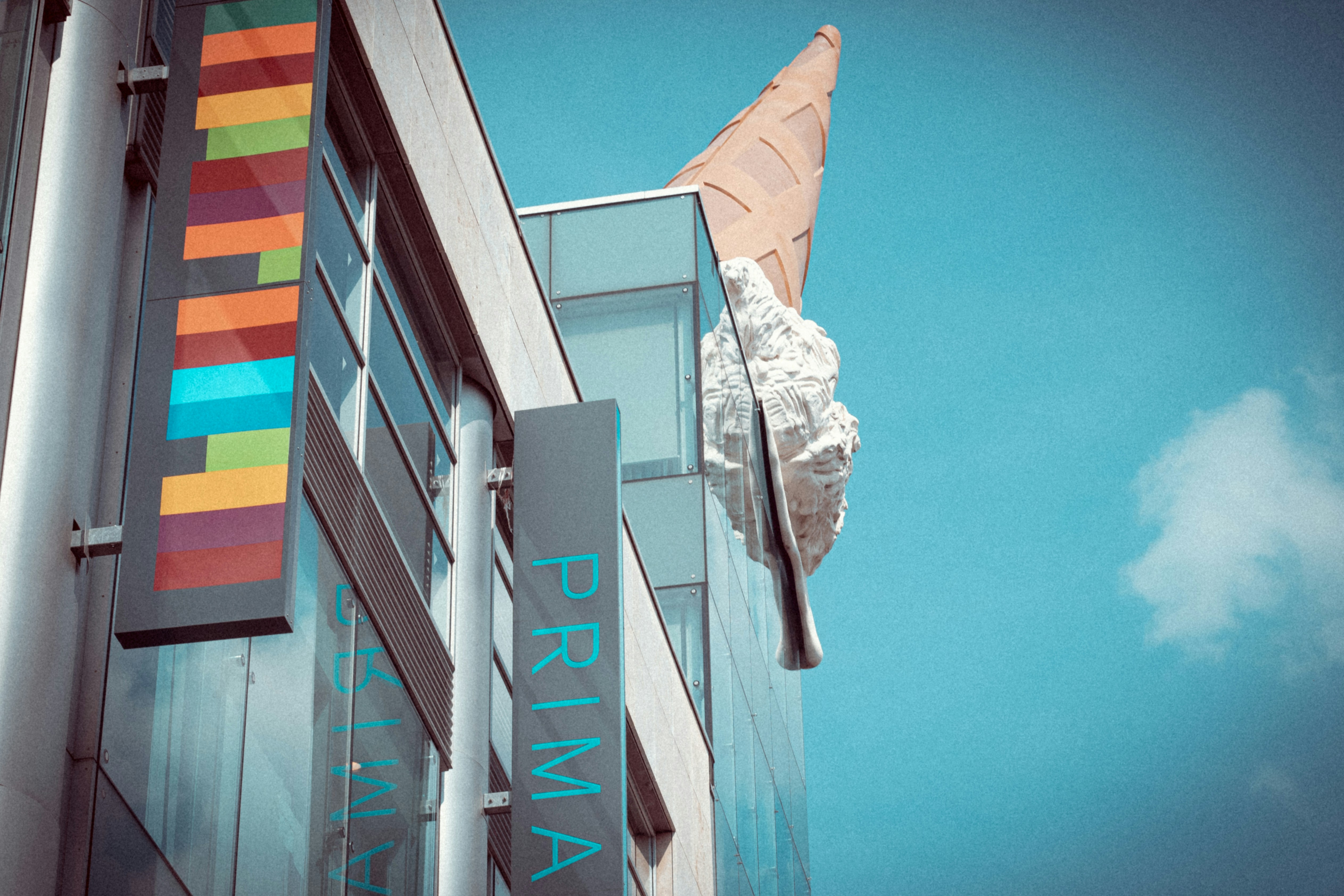 Scoop Spire Above Prism Facade