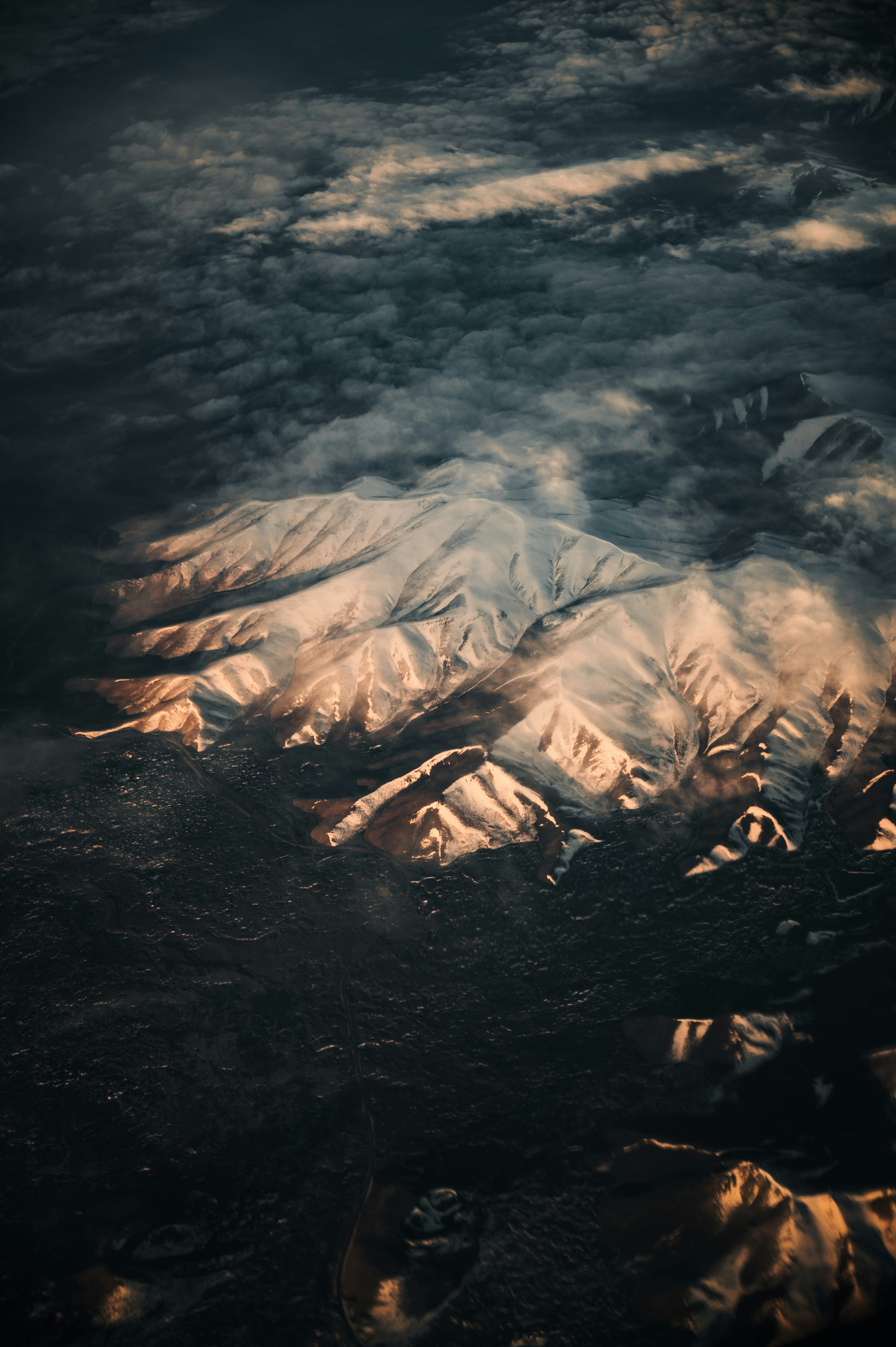 Dusk Light over Snow-Crowned Ridges: An Aerial Alpine View