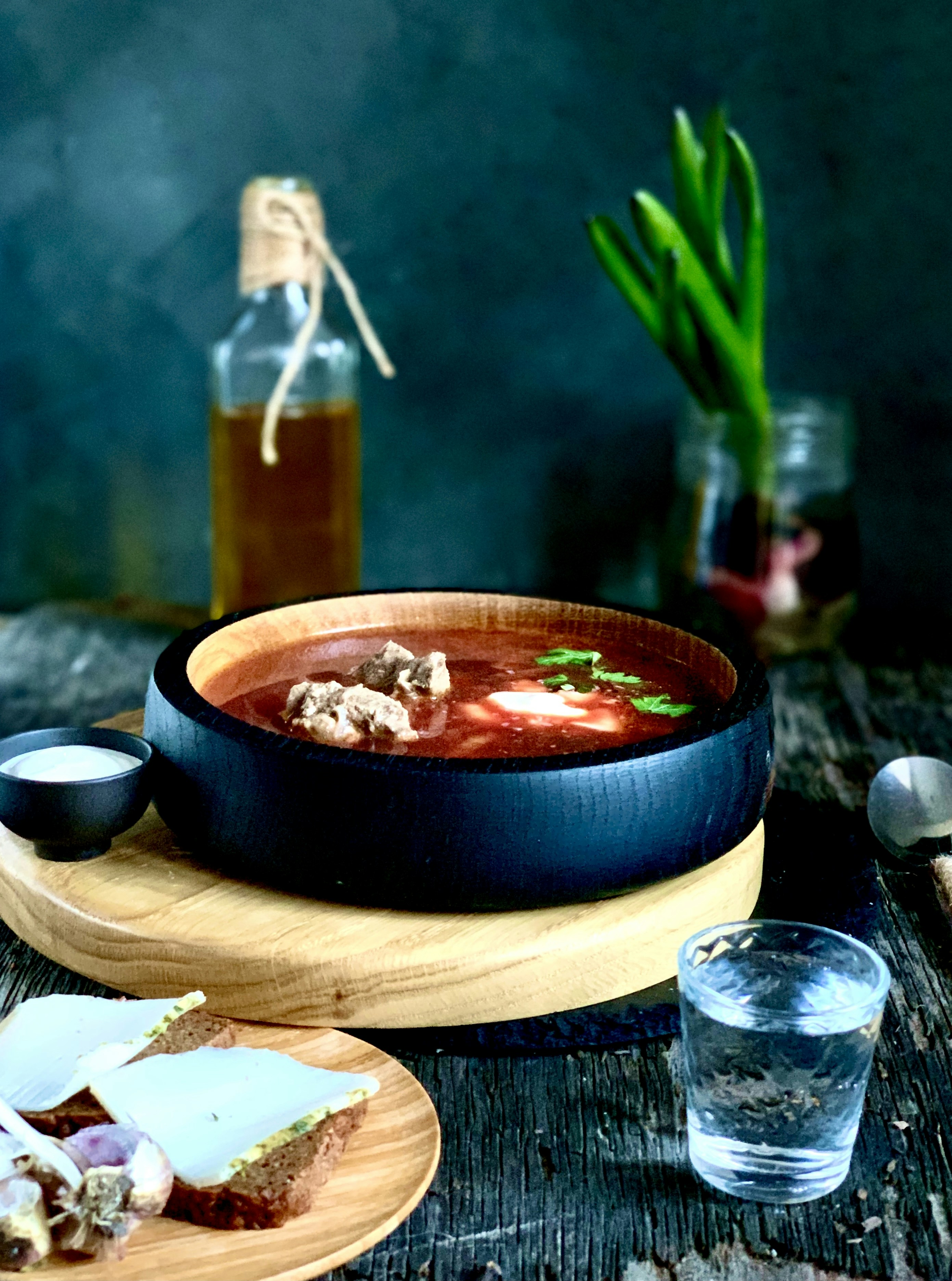 red soup in black ceramic bowl