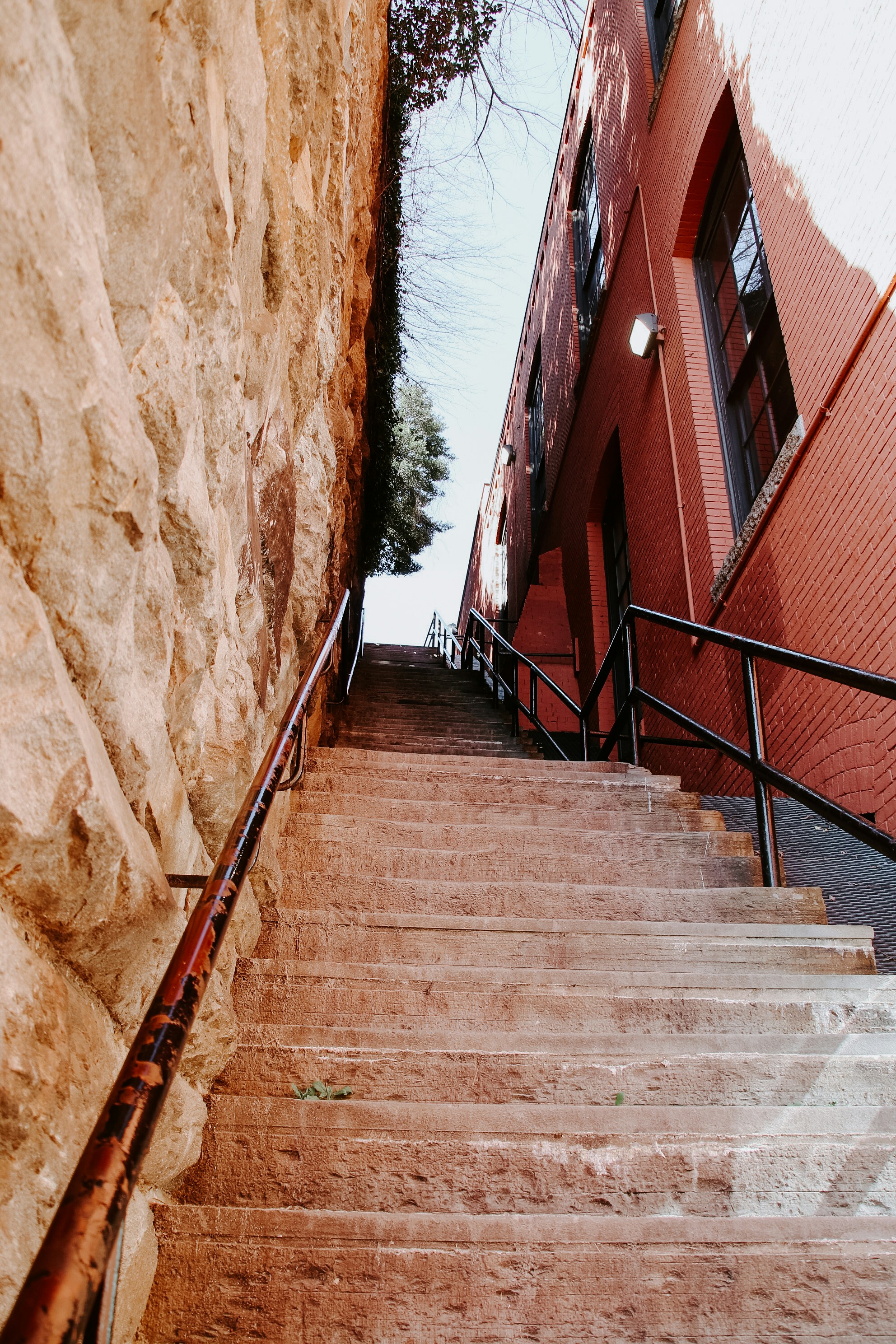 Red concrete building near body of water during daytime photo – Free ...