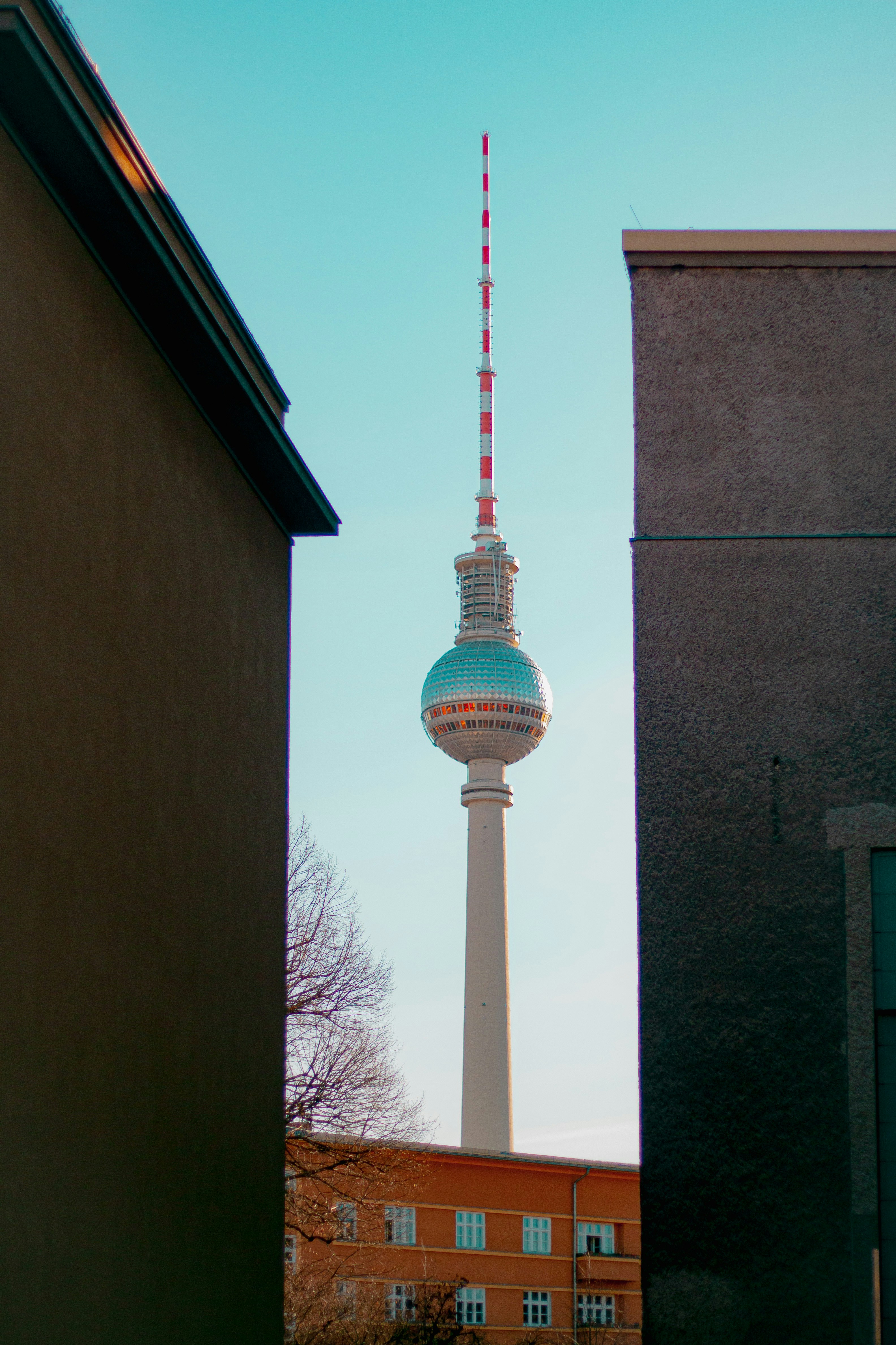 Framed Between Brick and Sky: Berlin's Fernsehturm Reaches the Blue