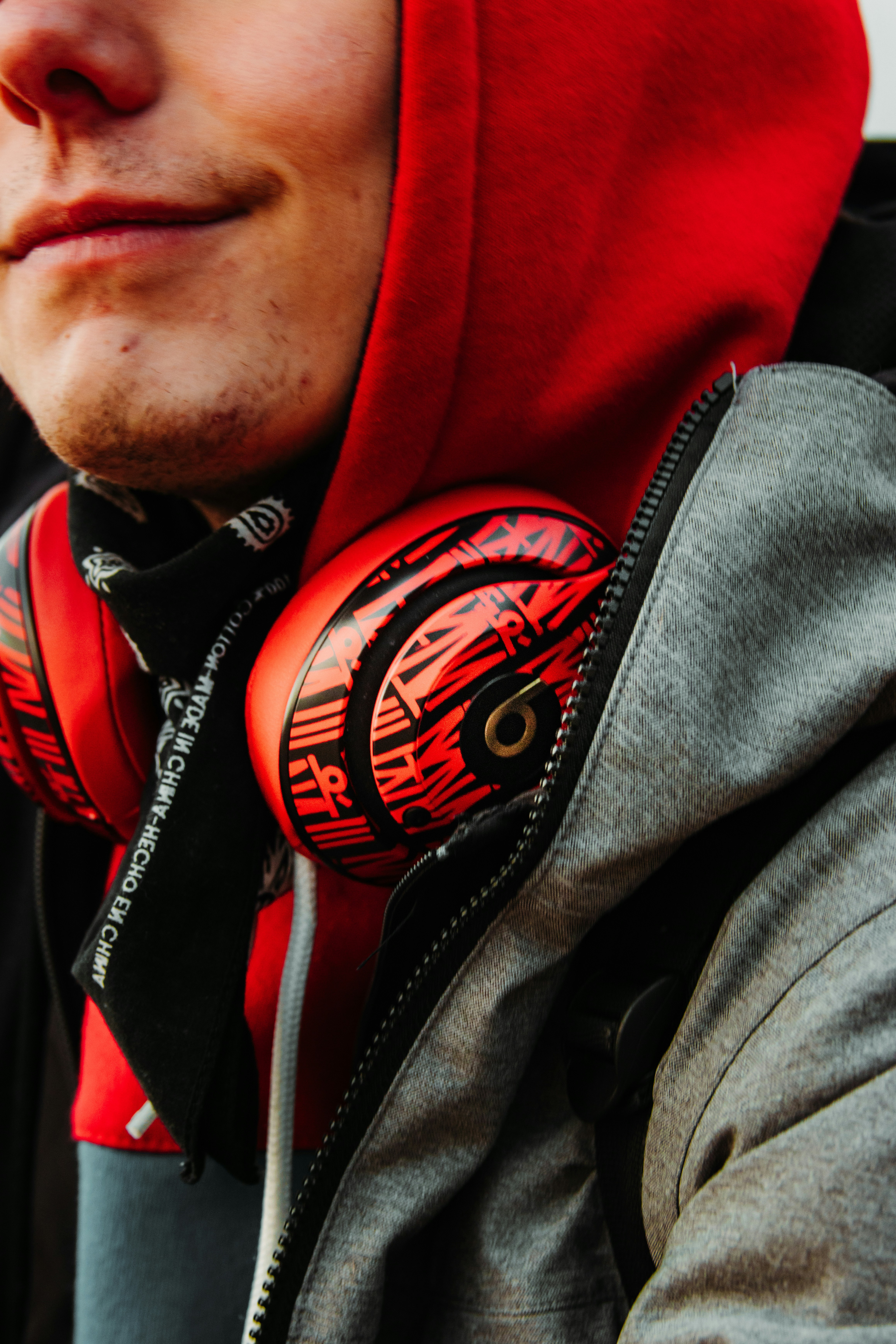 Scarlet Hoodie, Red Beats: A Tight Portrait of Texture and Focus