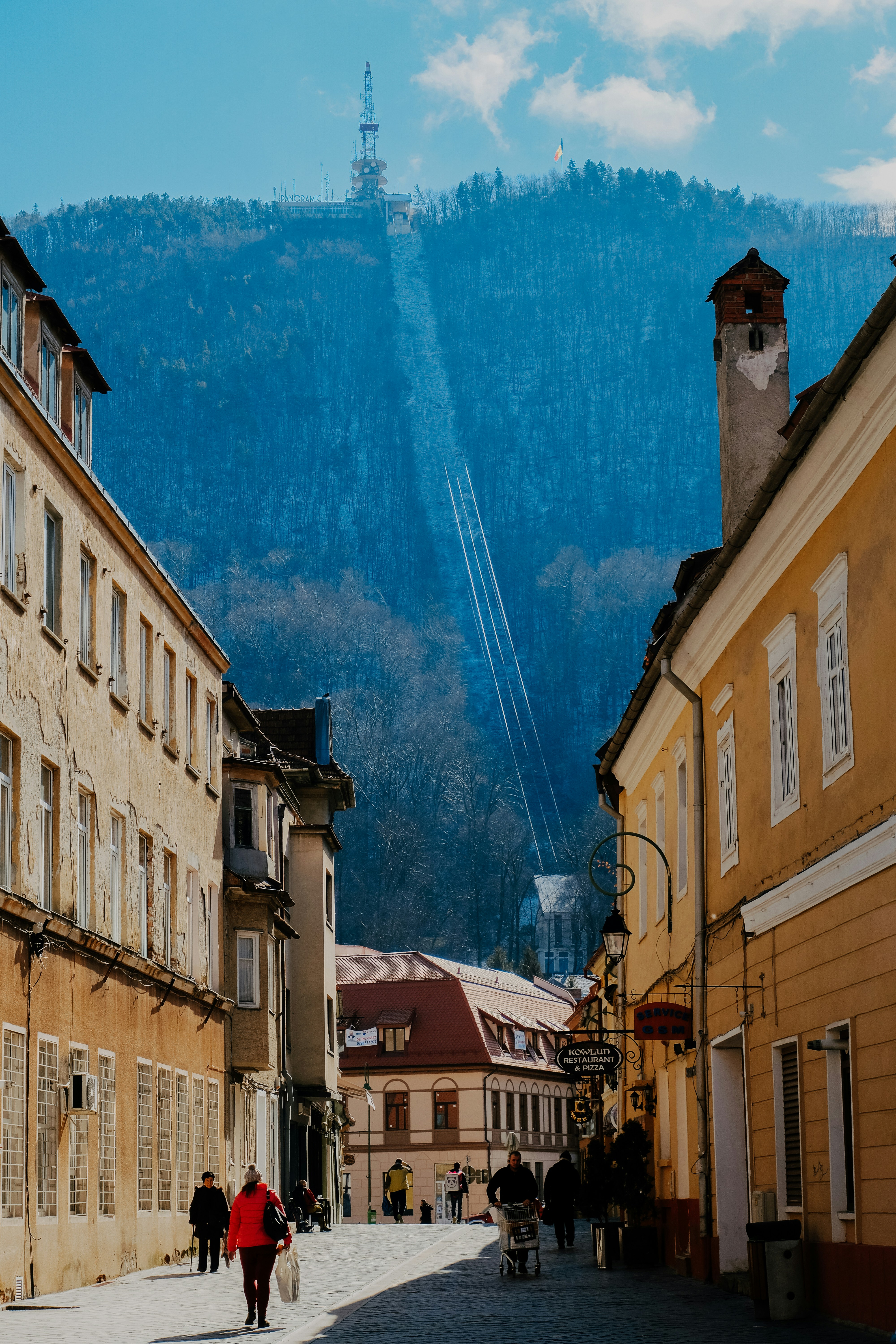 Ochre Facades Framing a Snow-Dusted Alpine Valley