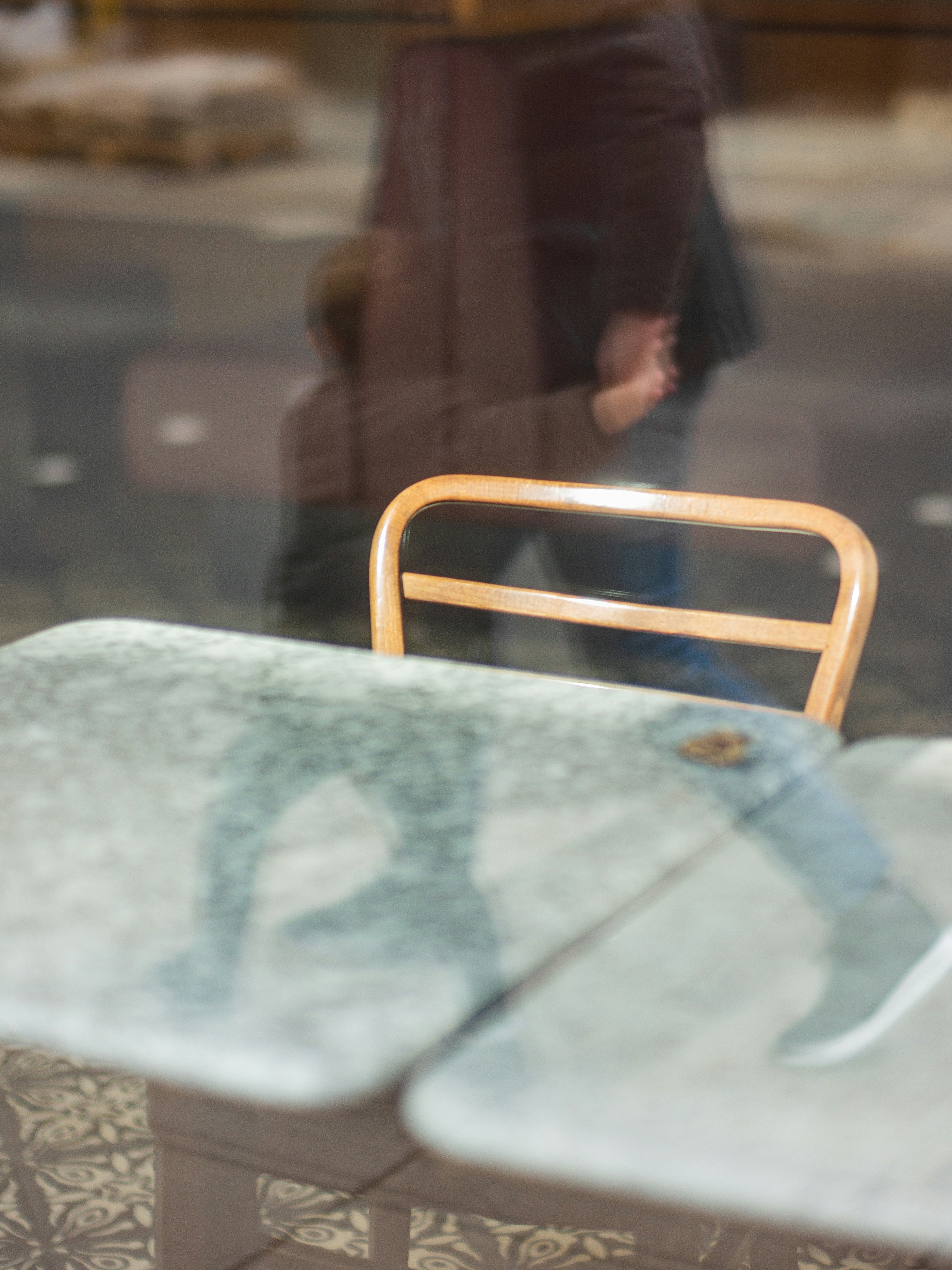 Copper Chairback at the Window: A Quiet Café Moment