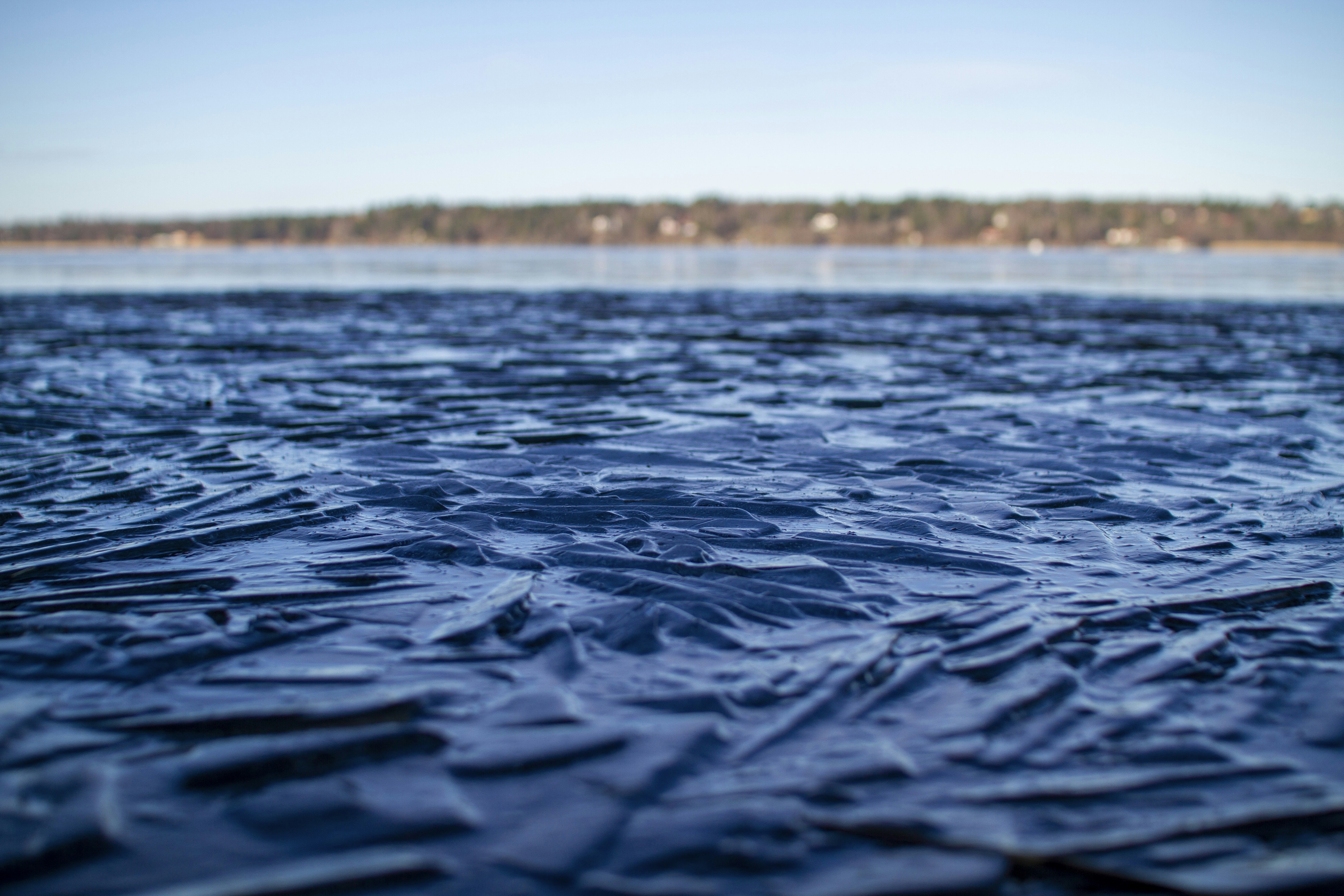 Body of water under blue sky during daytime photo – Free Lake Image on ...