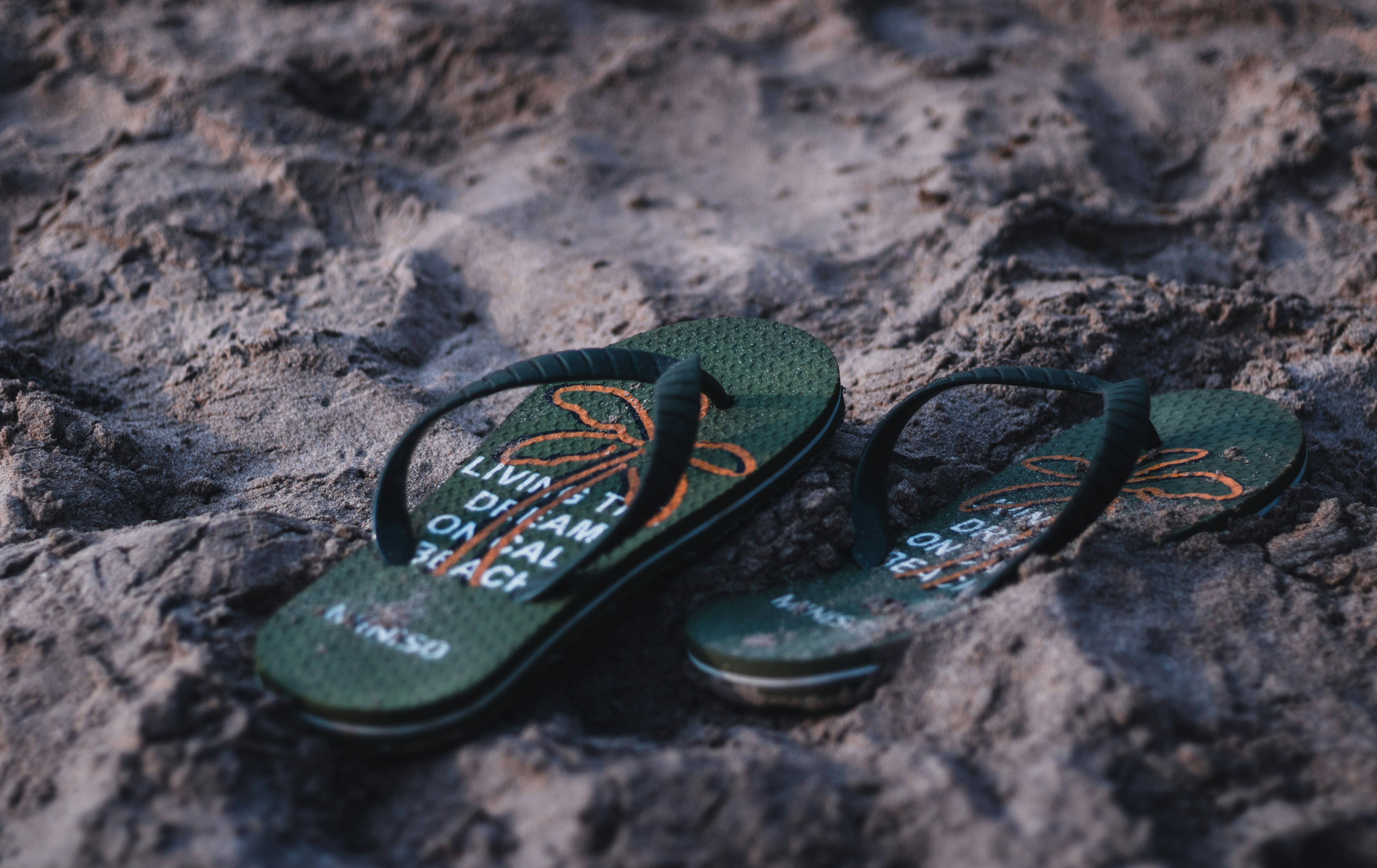 black and green flip flops