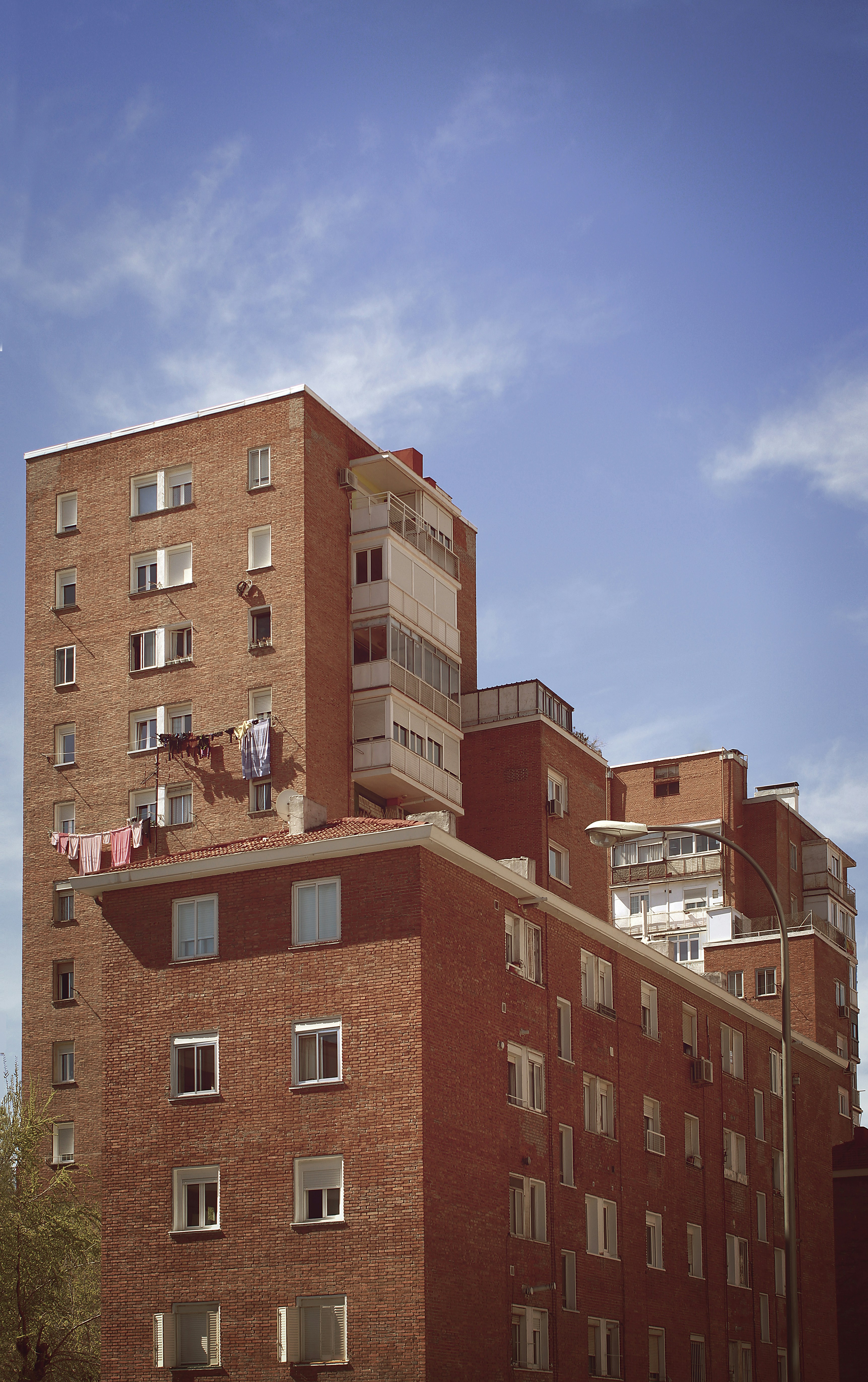 Brick-Clad Apartment Towers Rise Under a Crisp Afternoon Sky
