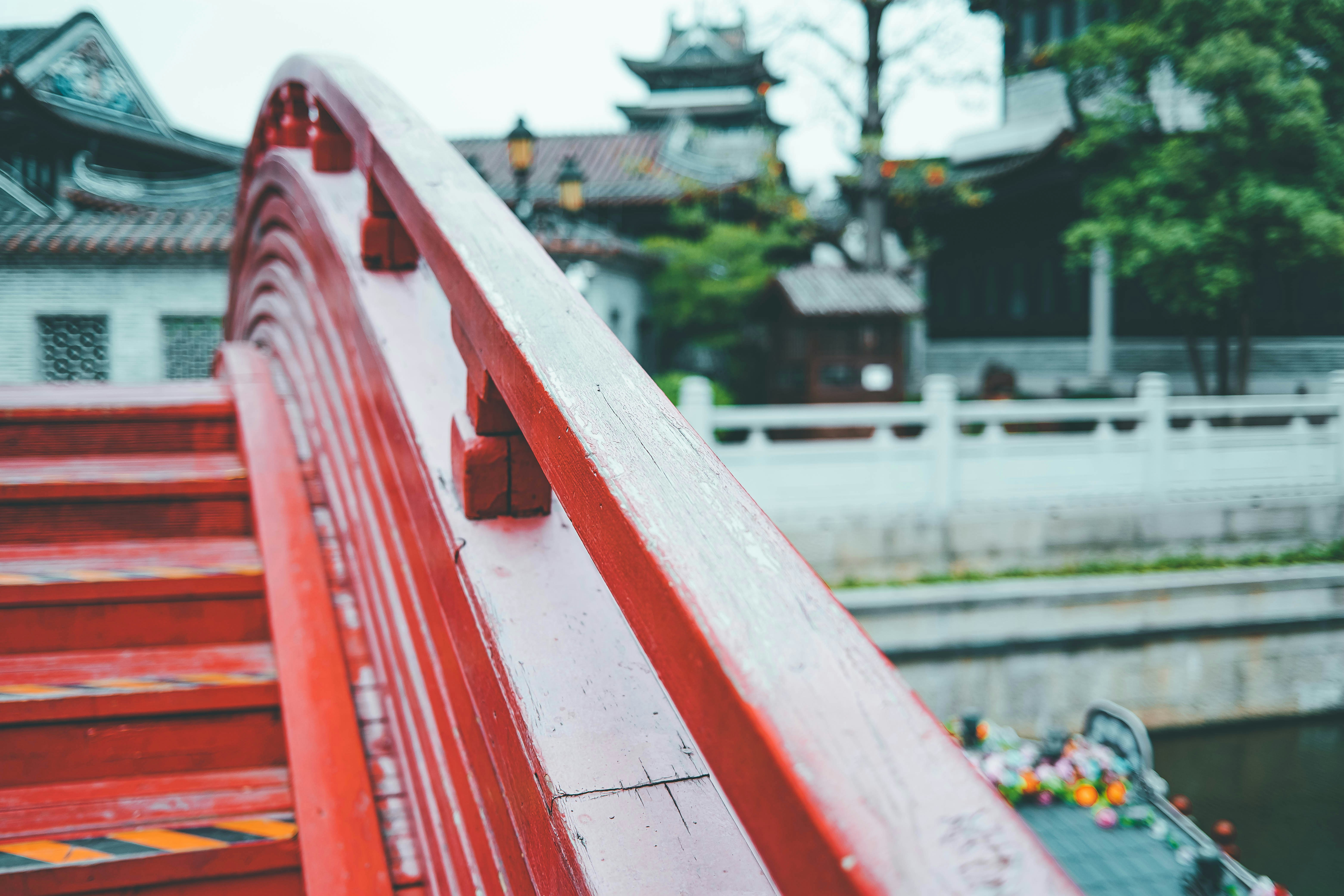 Red metal railings near green plants during daytime photo – Free ...