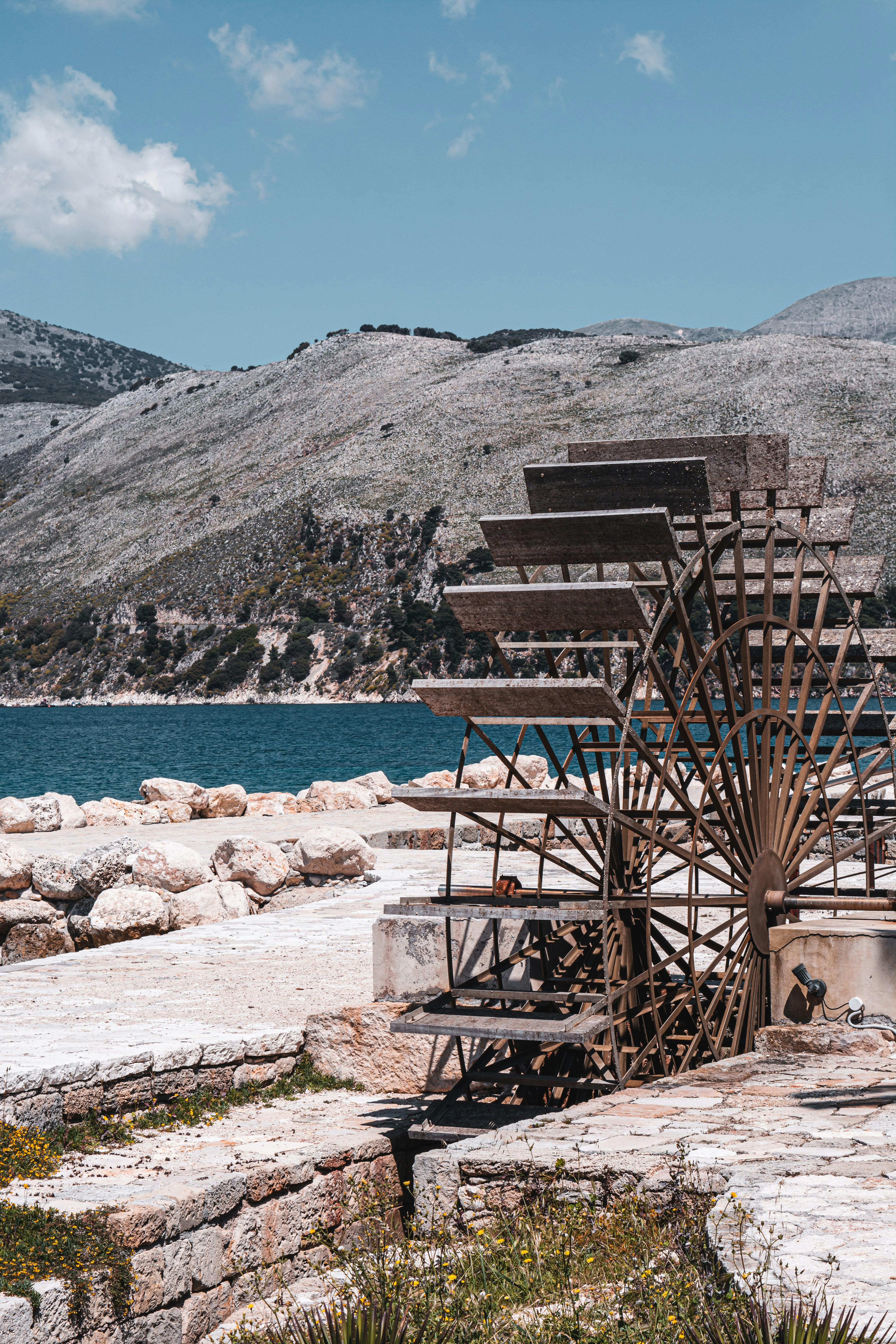 Waterwheel by the Coastal Stonework: A Quiet Seaside Scene