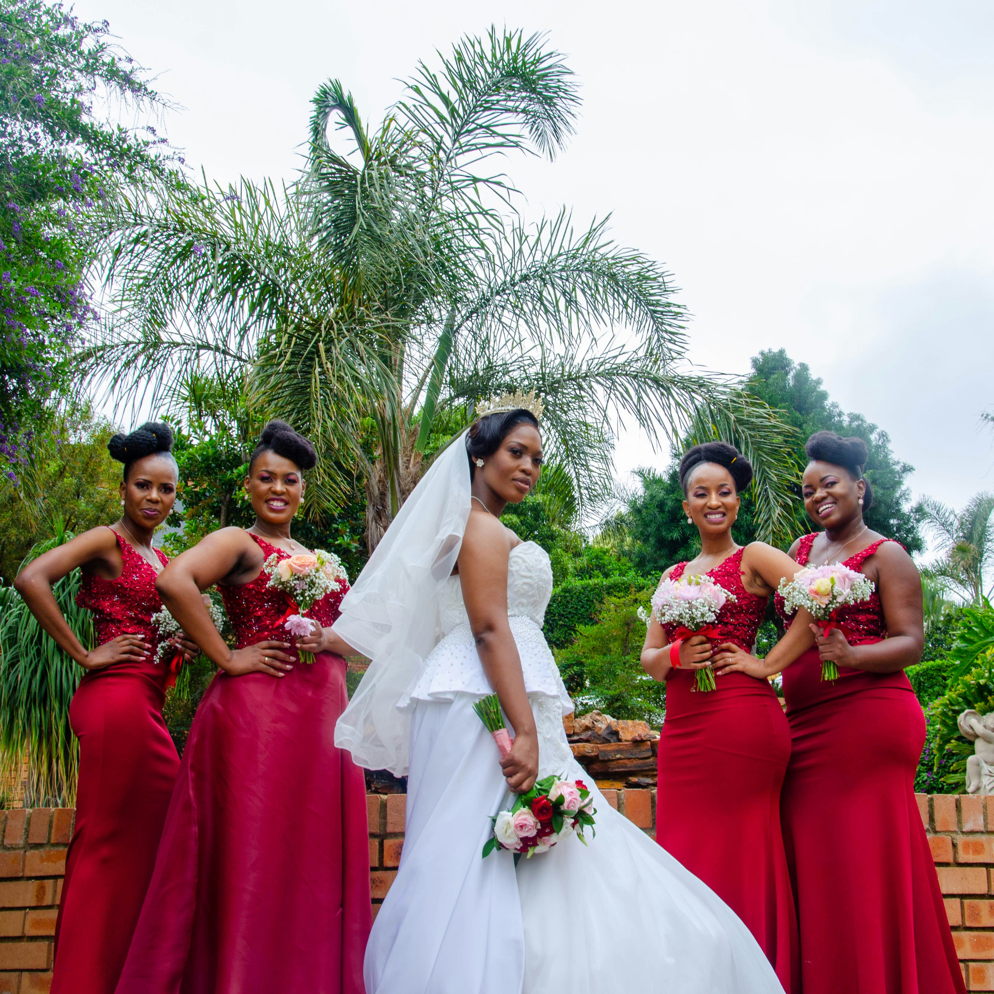 Woman in red dress holding bouquet of flowers photo – Free Rustenburg ...
