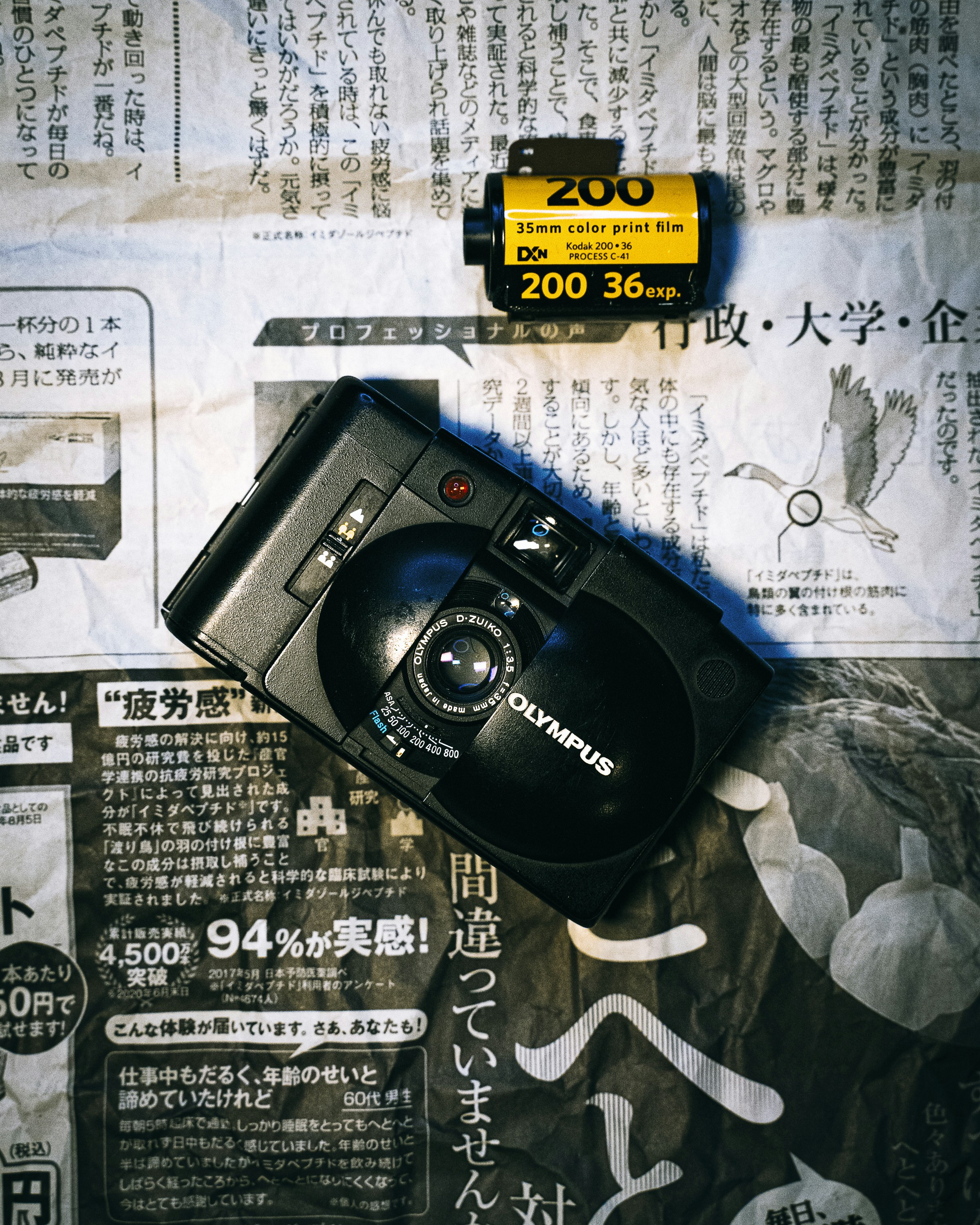 Newsprint & Film: An Olympus Camera Paired with a 200-Exposure Roll