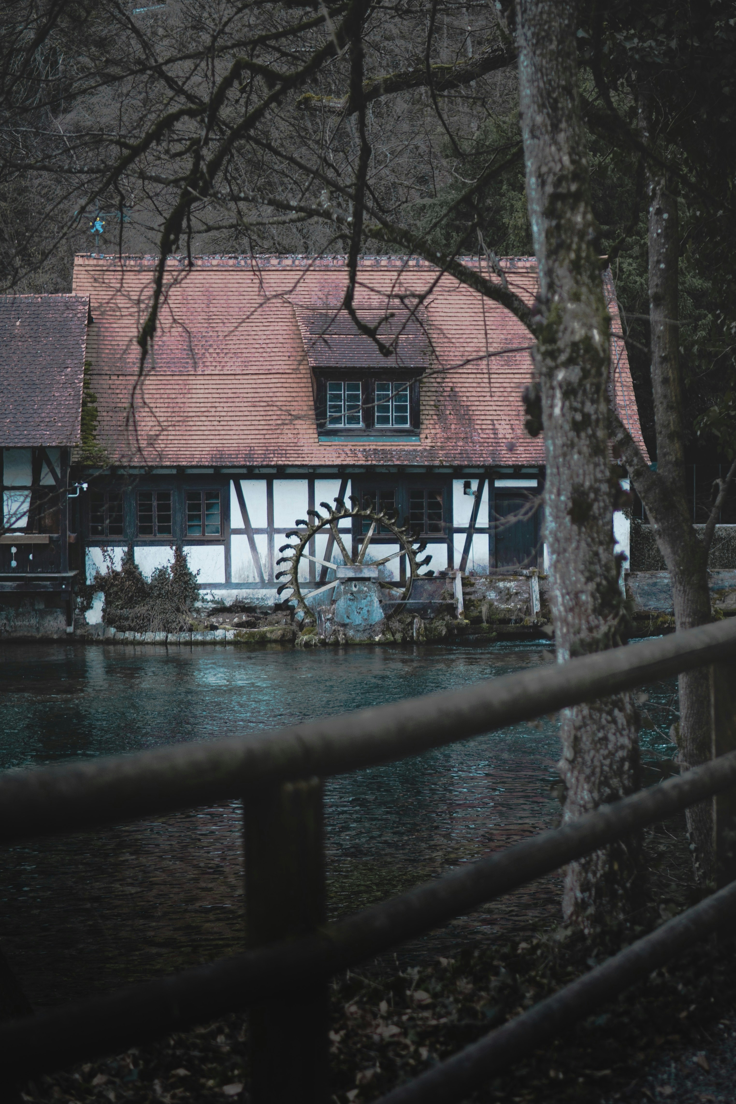 Waterwheel by a Timber-Framed Mill Along a Quiet Canal