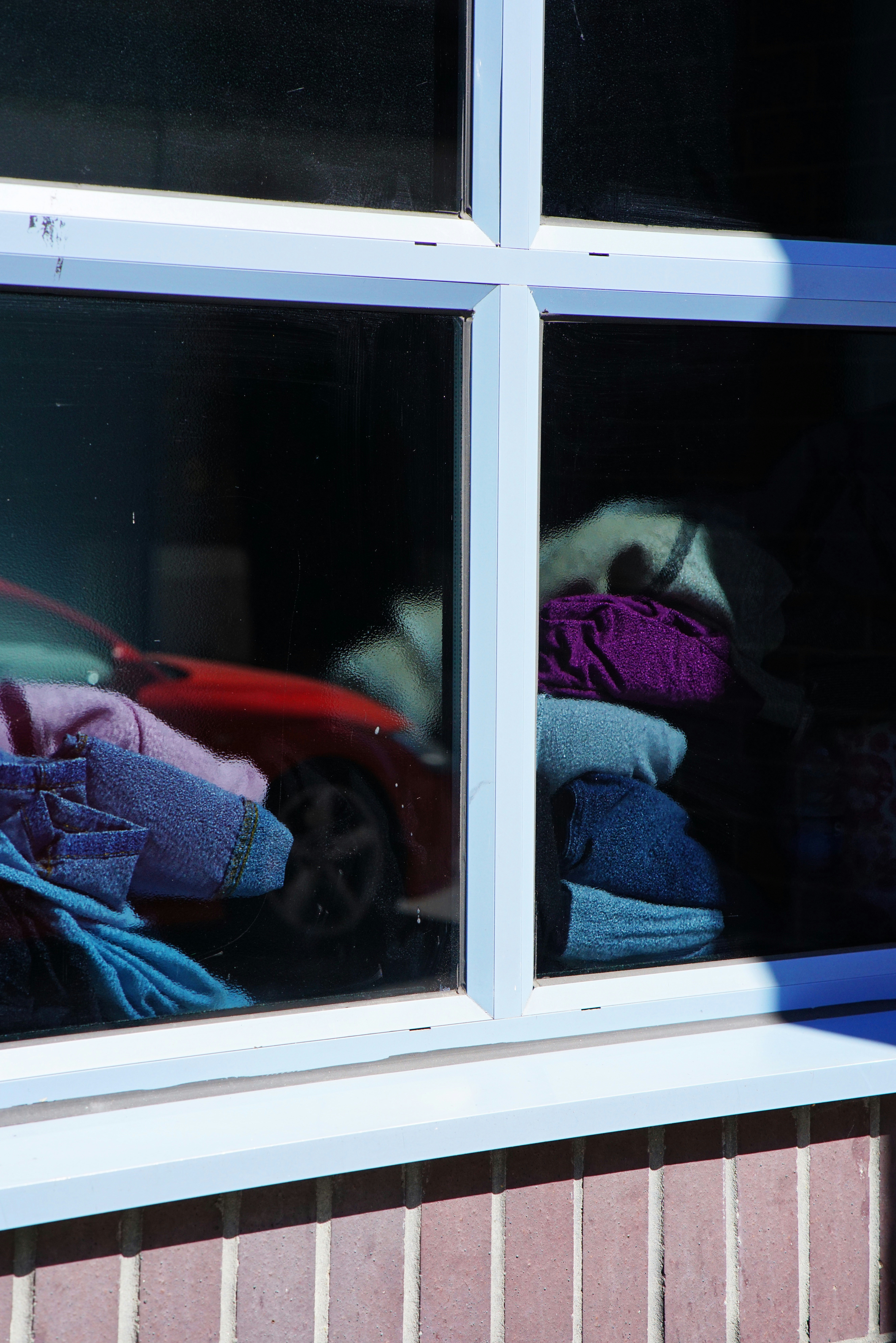Red car in front of white framed glass window photo – Free Uk Image on ...