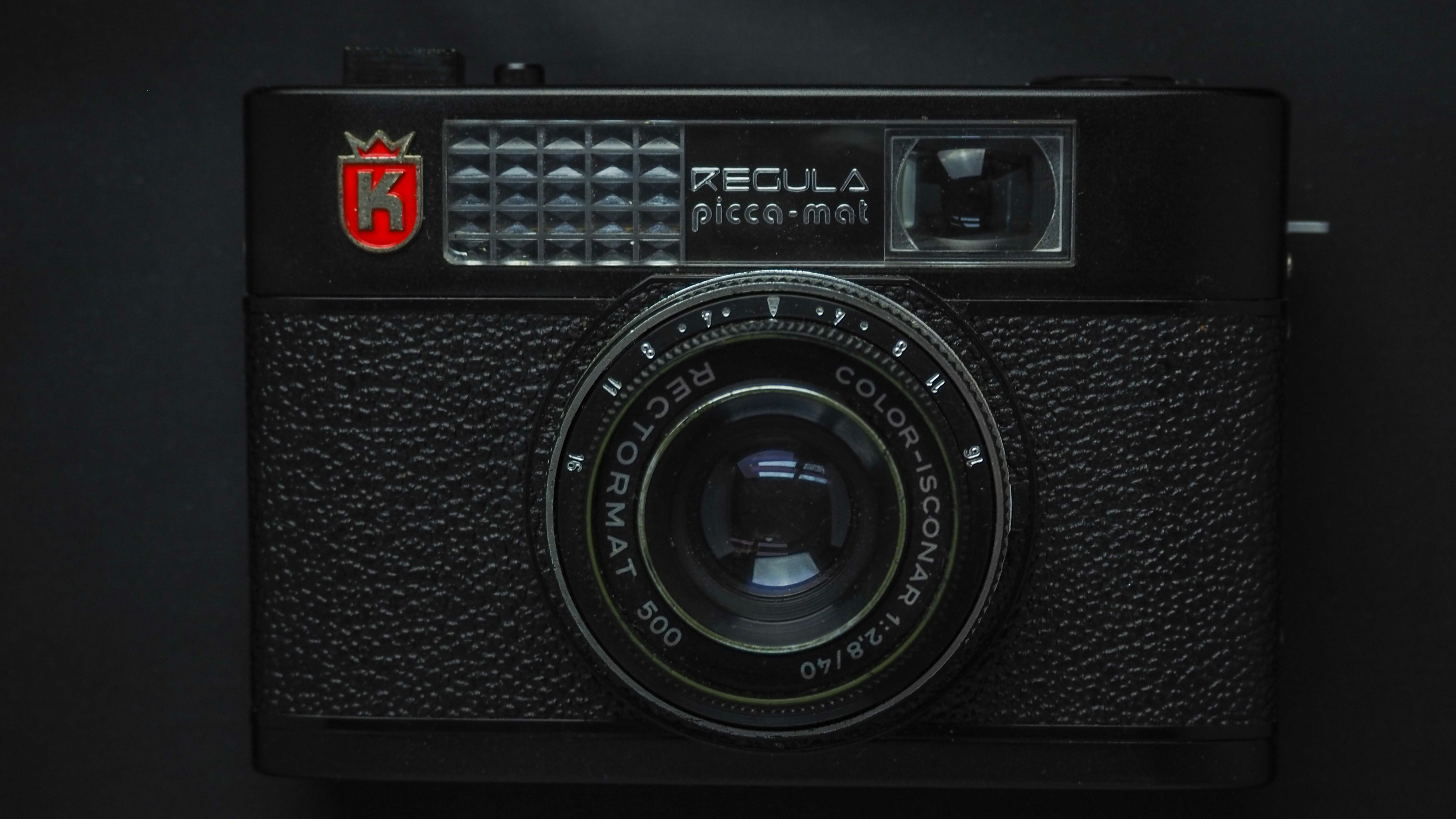 Regula Picca-Mat camera displayed against a dark background, showcasing its vintage design and intricate detailing.