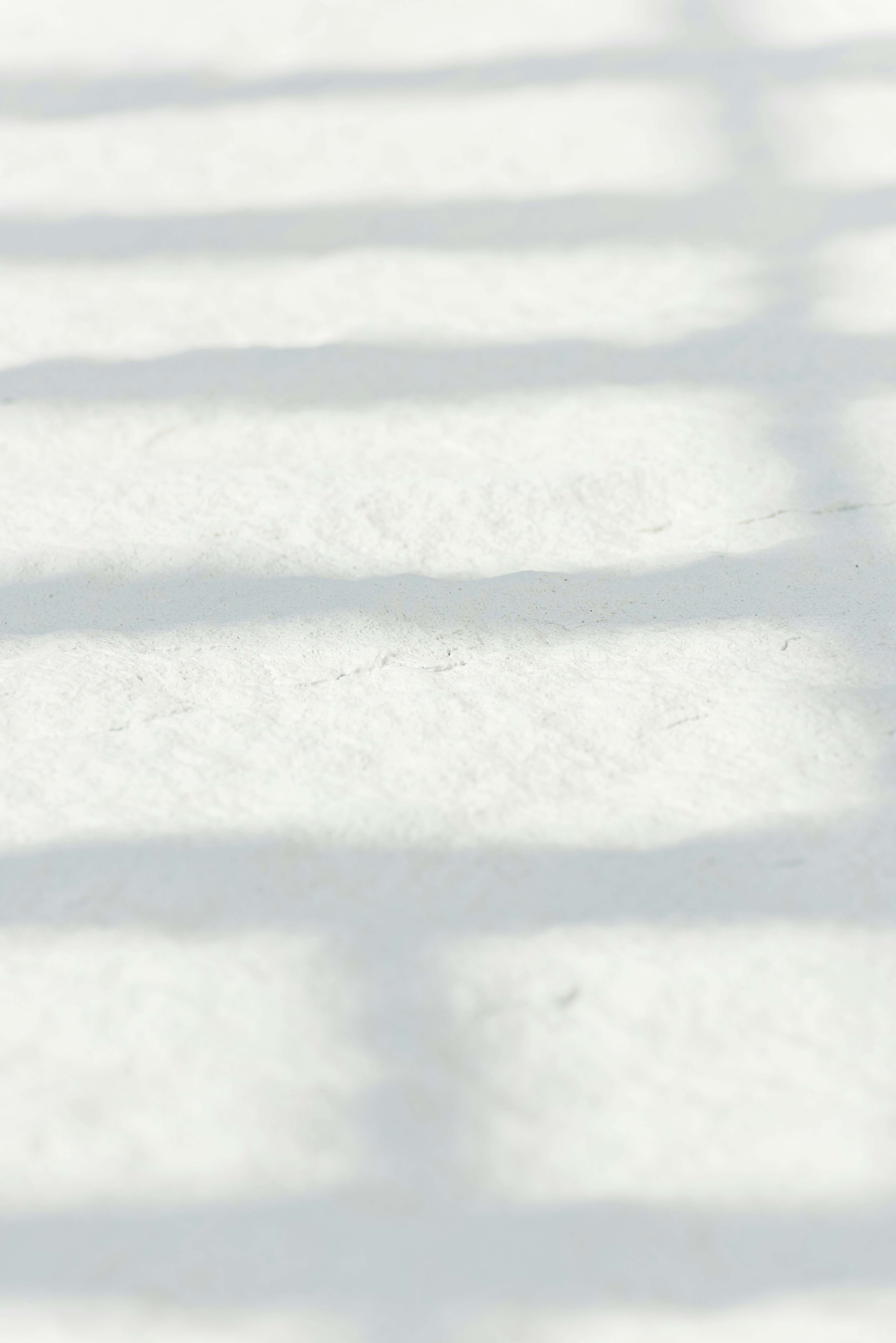 Shadow Stripes over Quiet Snowfield