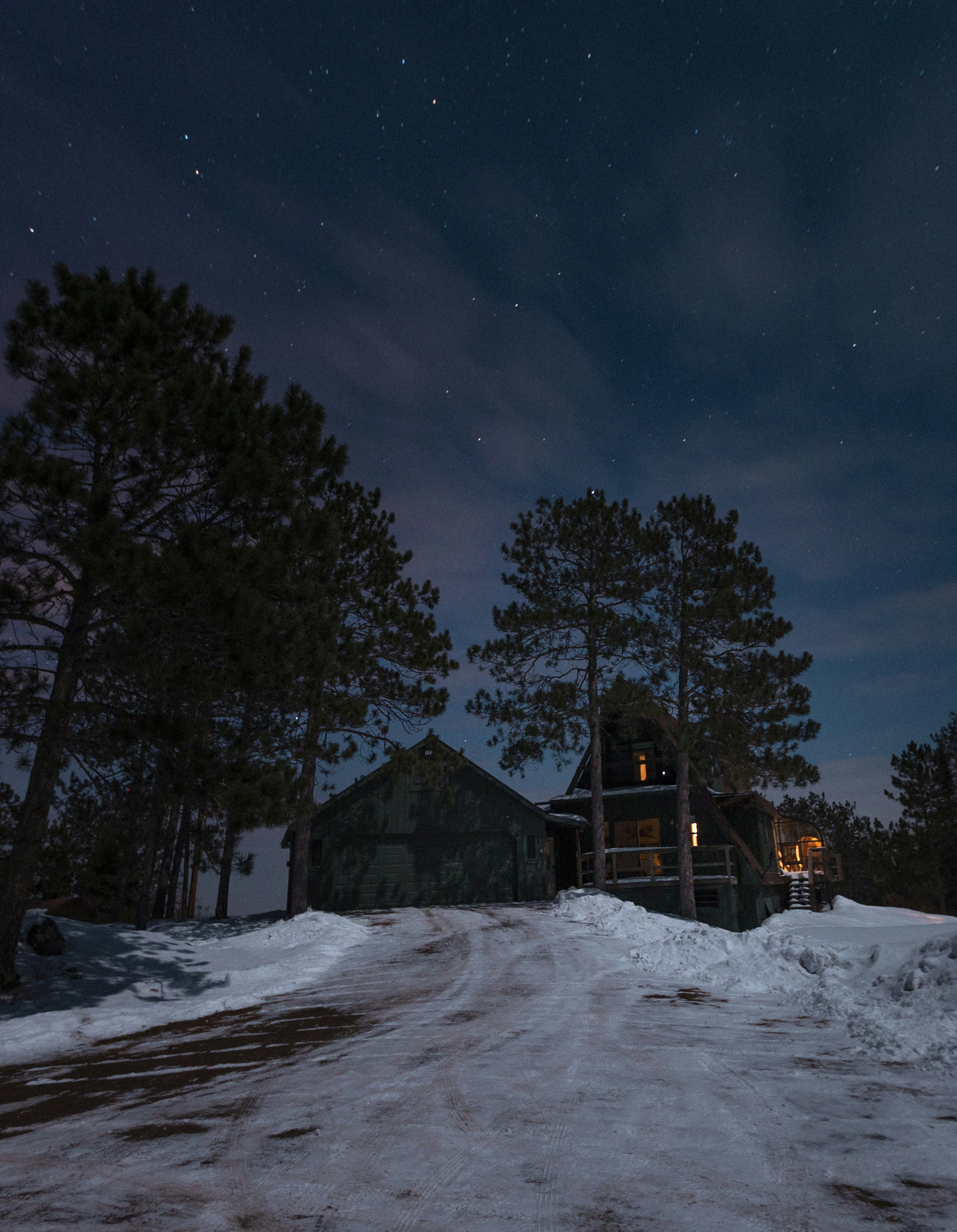 Whispers of Winter: A Cabin Amidst the Pines