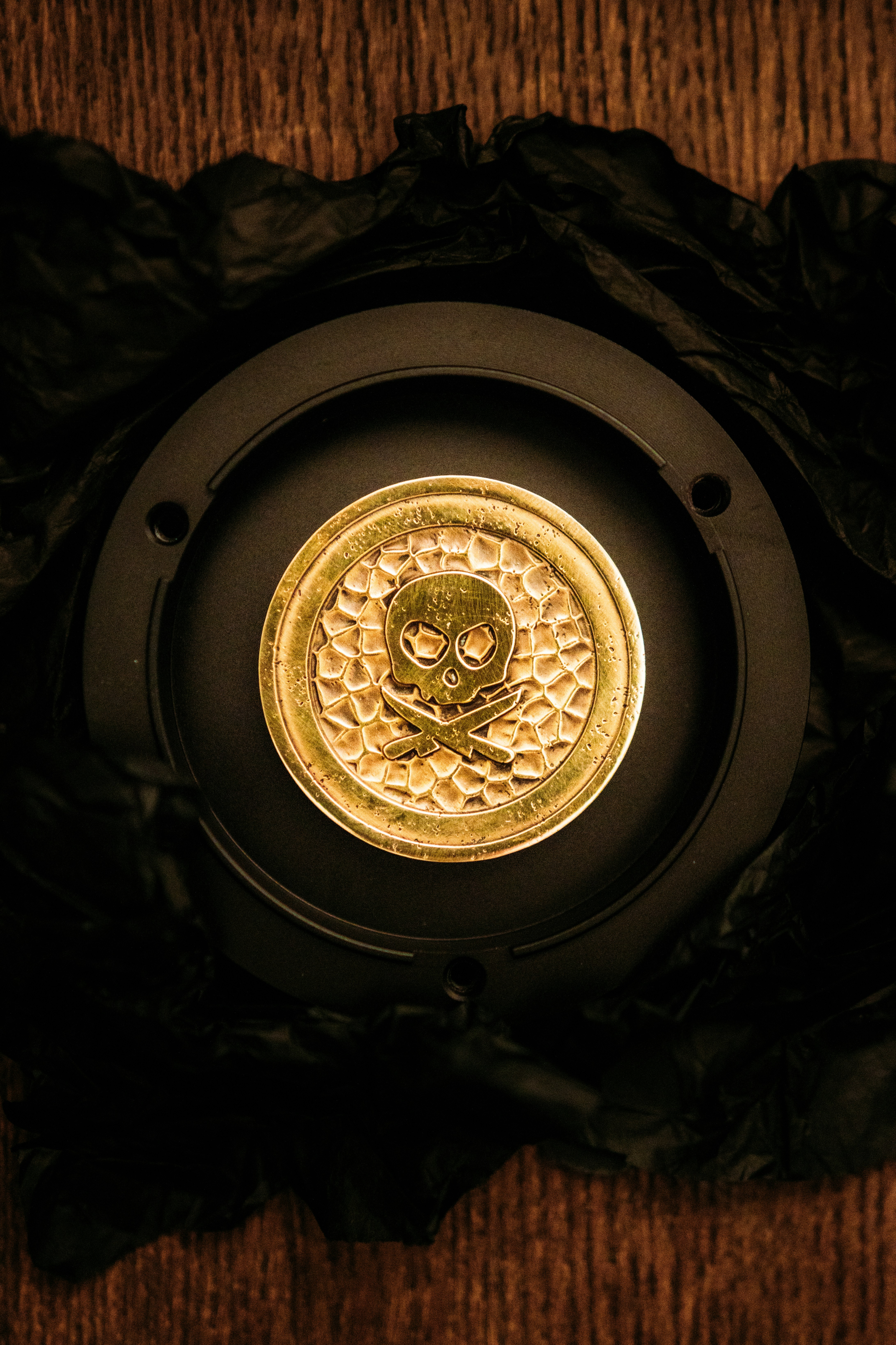 Gold Skull Medallion Centered in a Dark Wrapped Ring