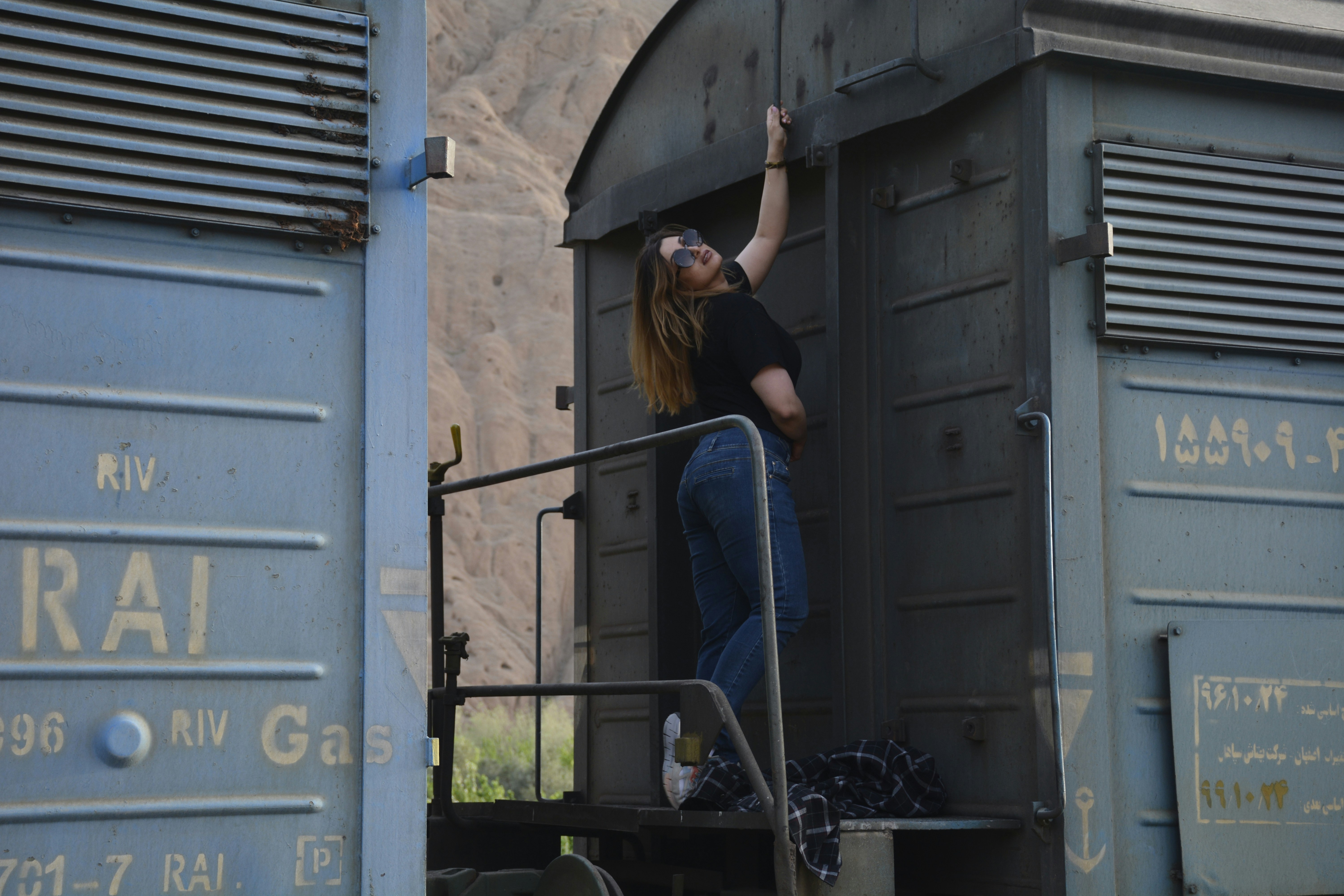 Climber on a weathered railcar doorway