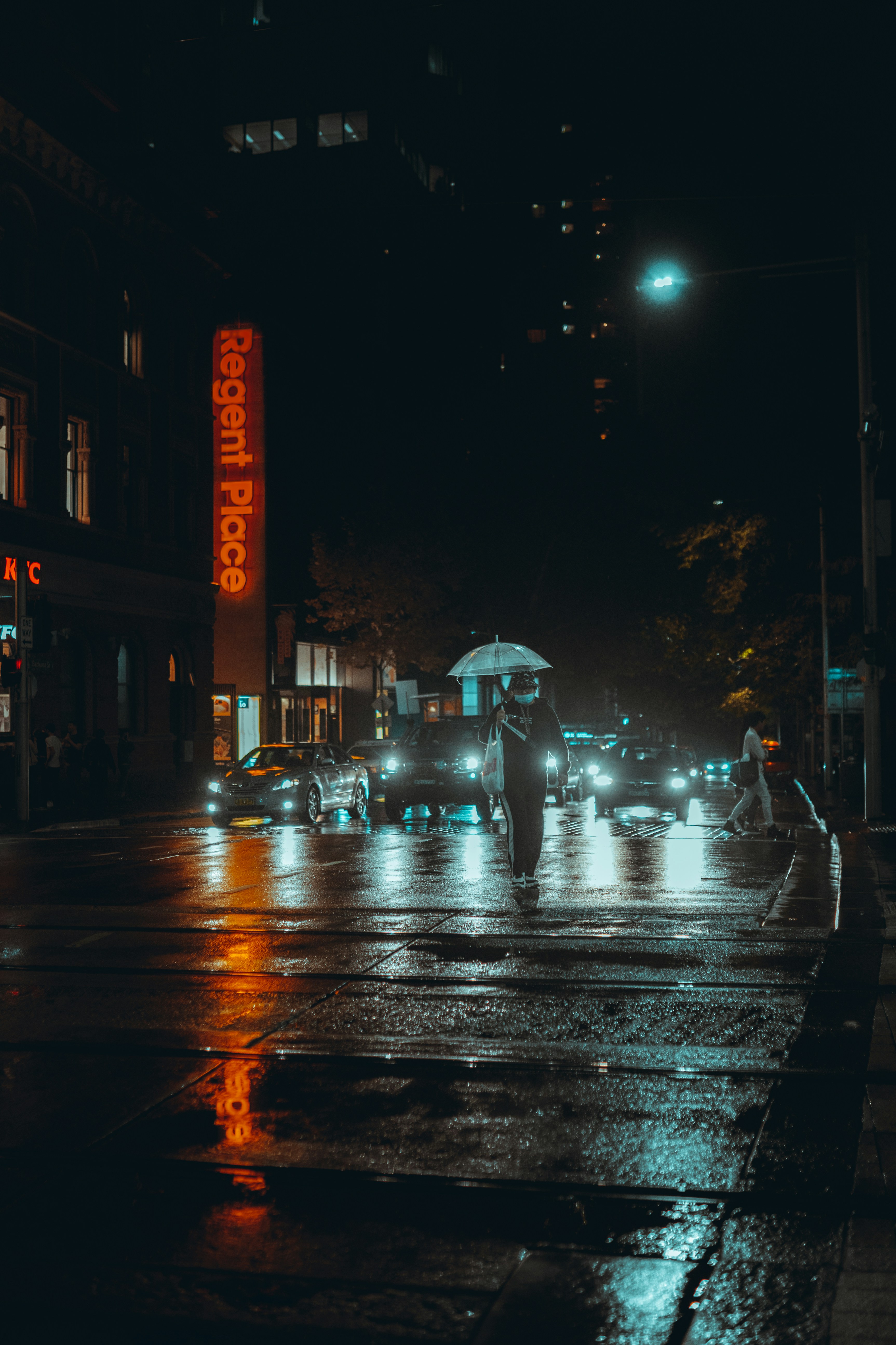 people walking on street during night time