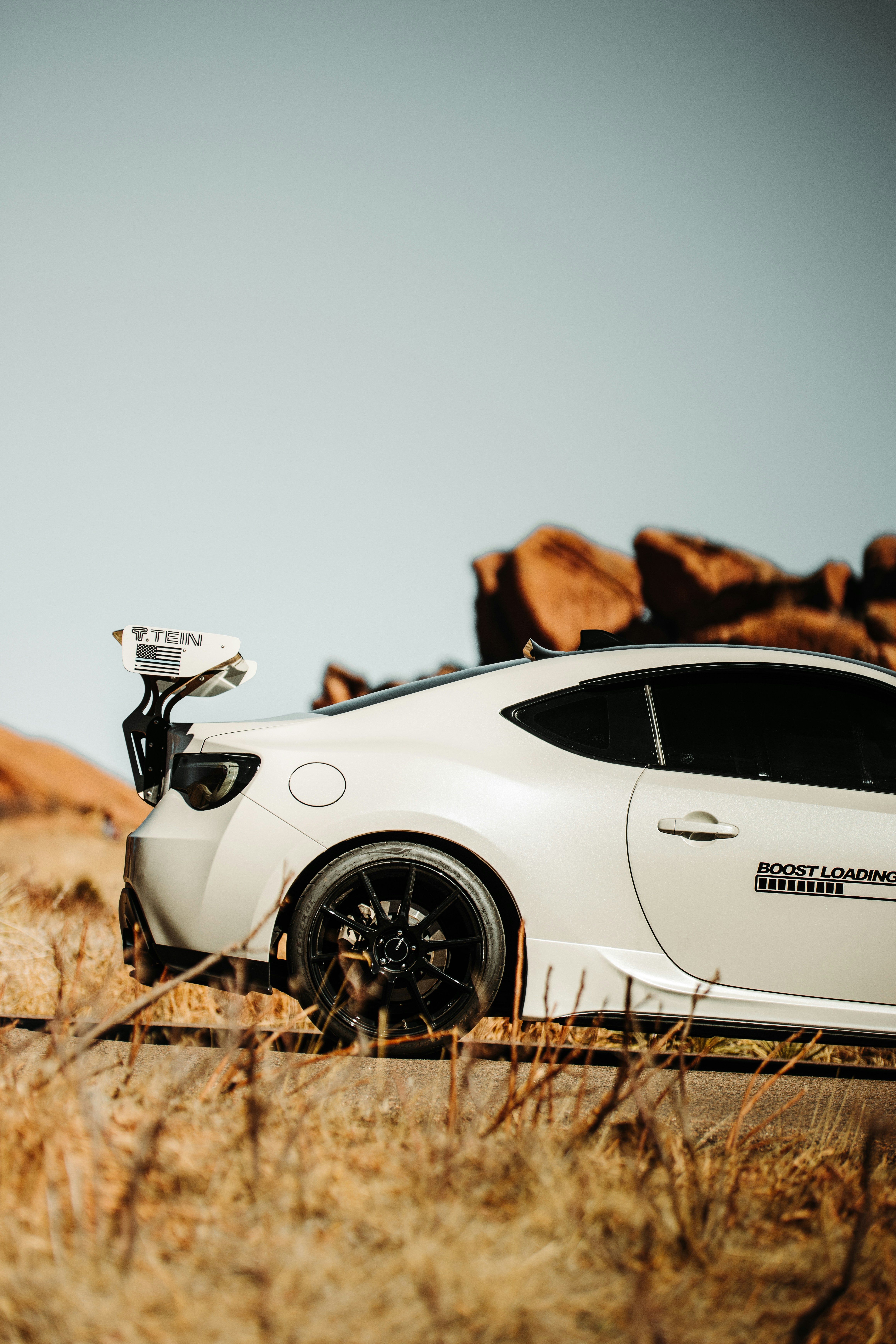 instagram - @jakobnoahrosen | white porsche 911 on brown field during daytime