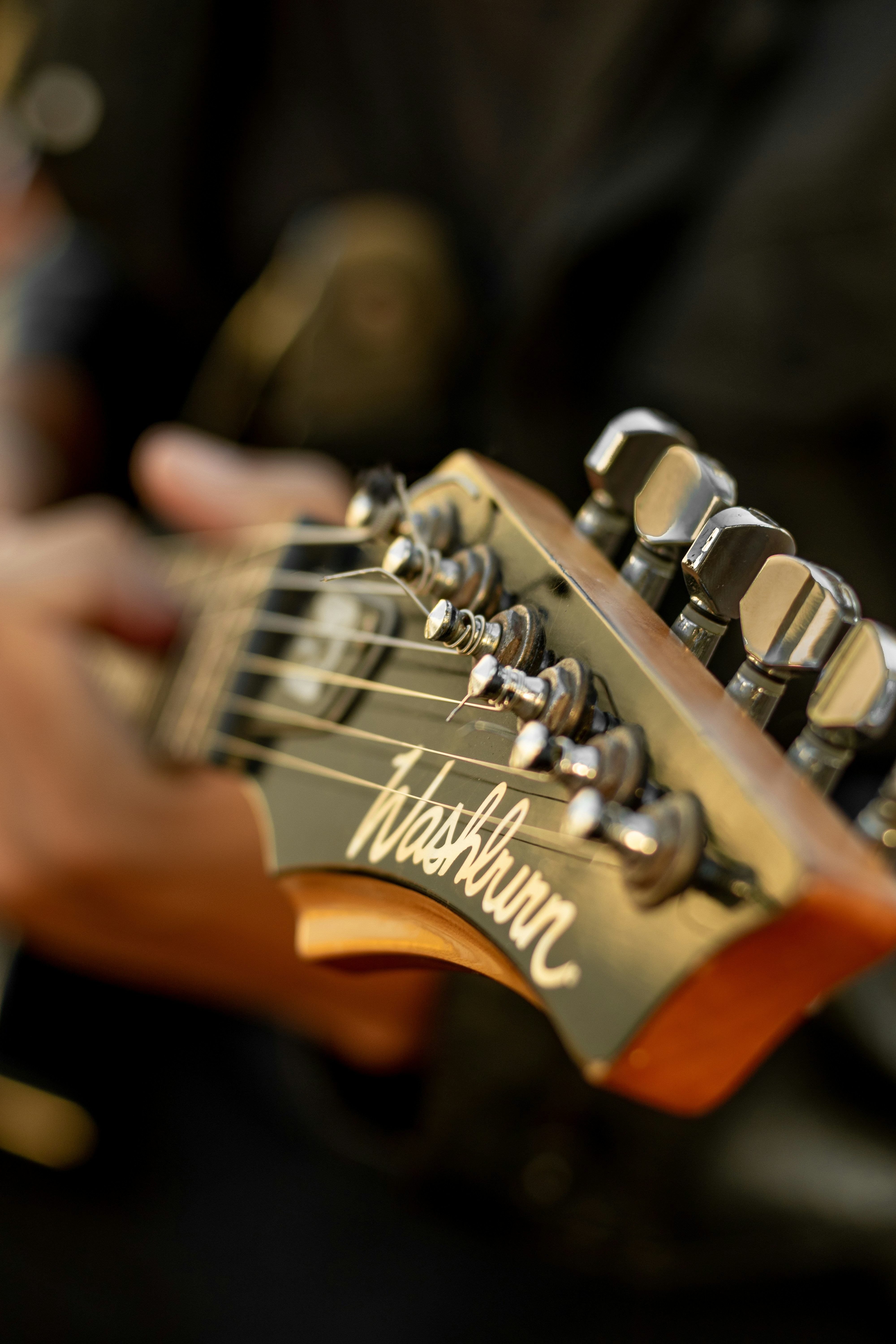 Tuned Strings: Close-Up of a Guitar Headstock in Soft Focus