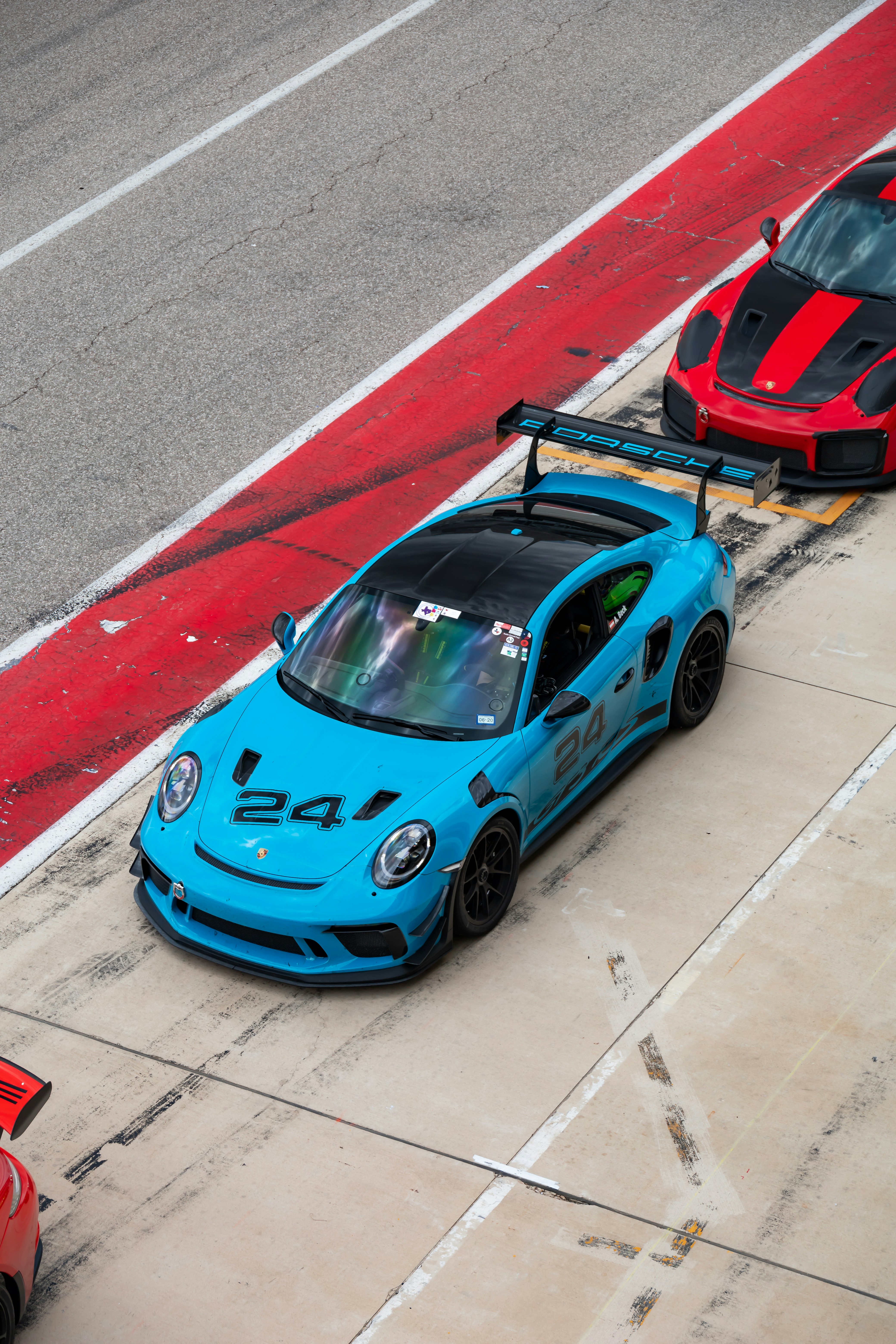 Blue and red car on road photo – Free Austin Image on Unsplash