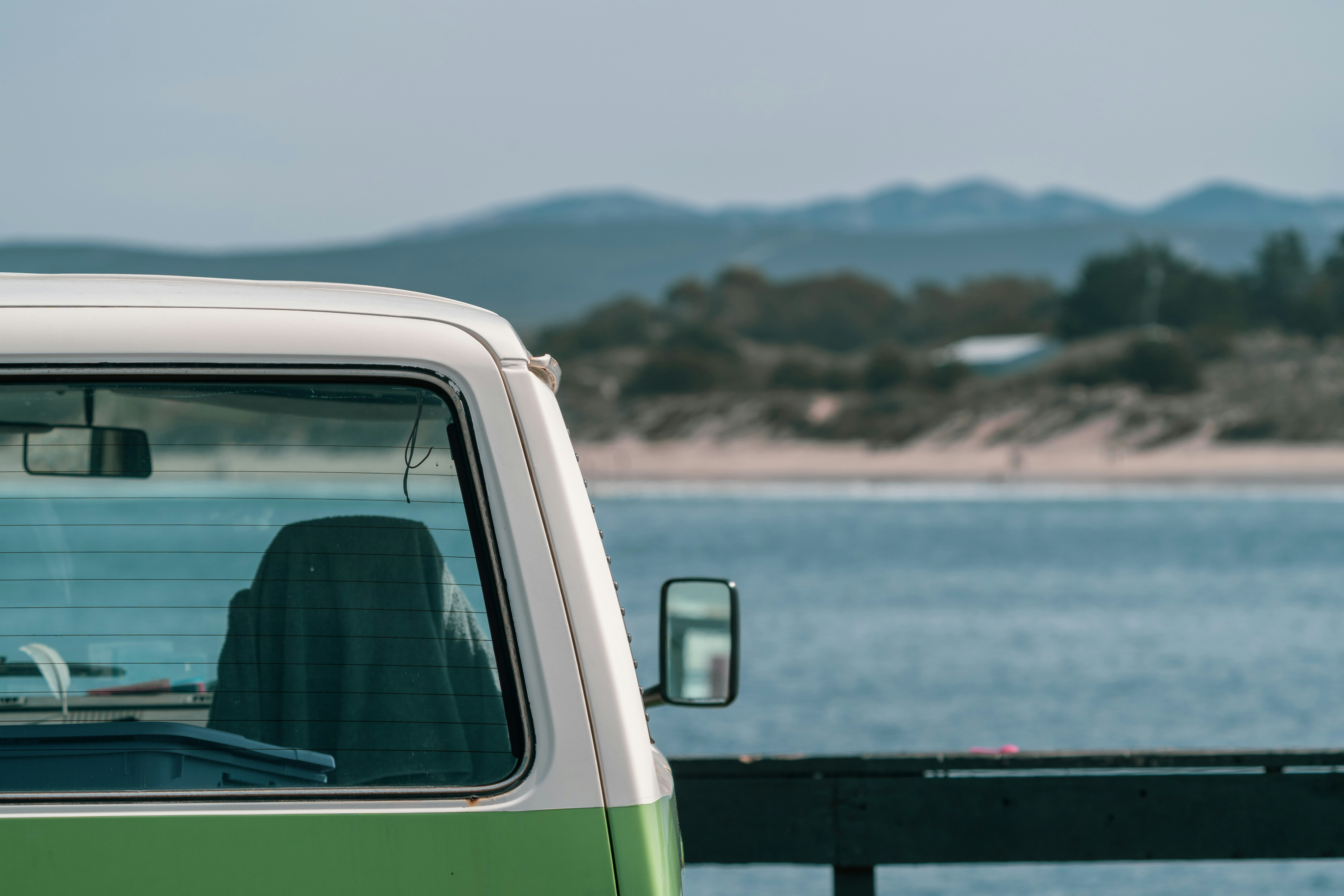 Pastel VW by the Water: A Quiet Window into Coastal Calm