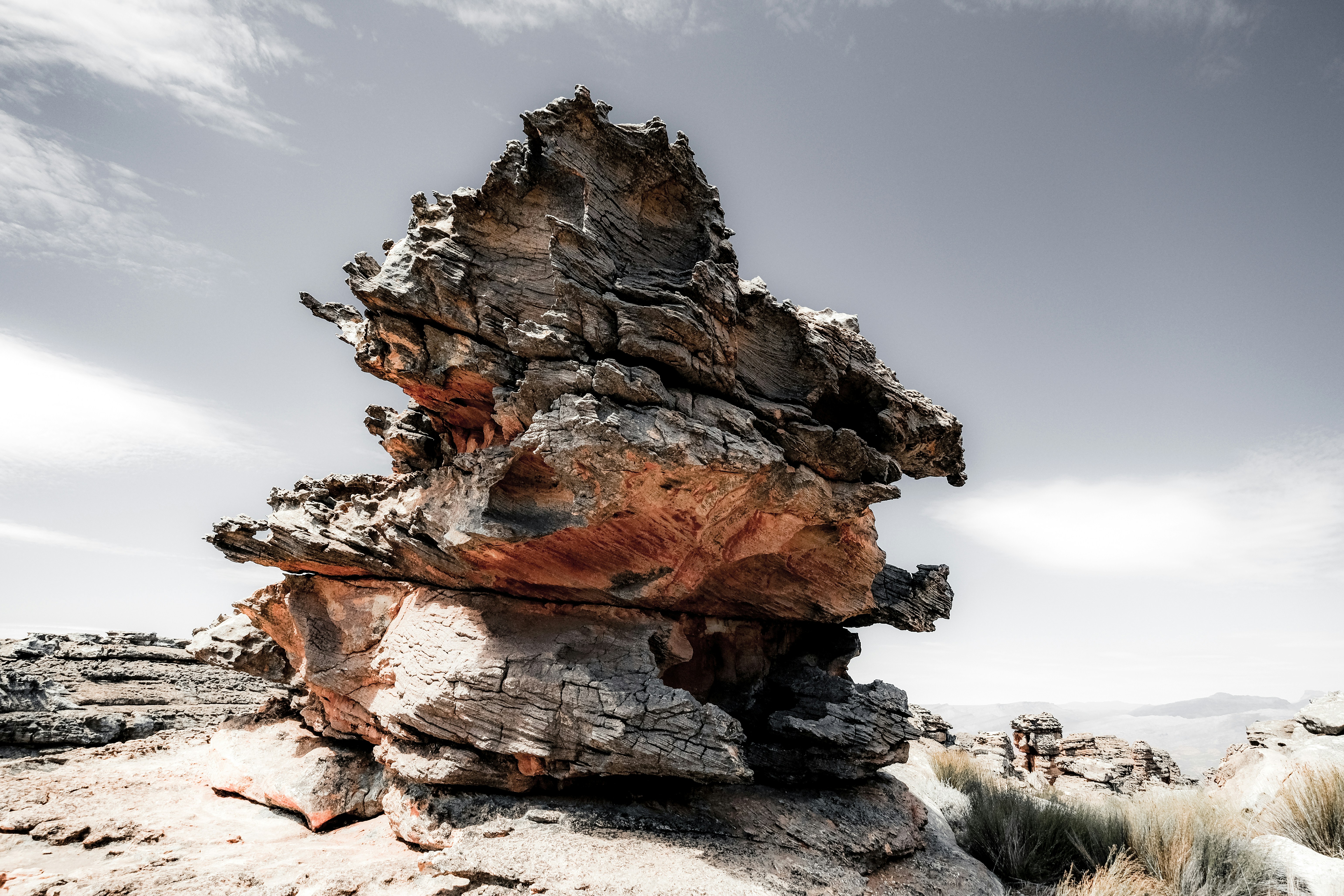Strata Sentinel: Weathered Rock Stack in a Sunlit Desert
