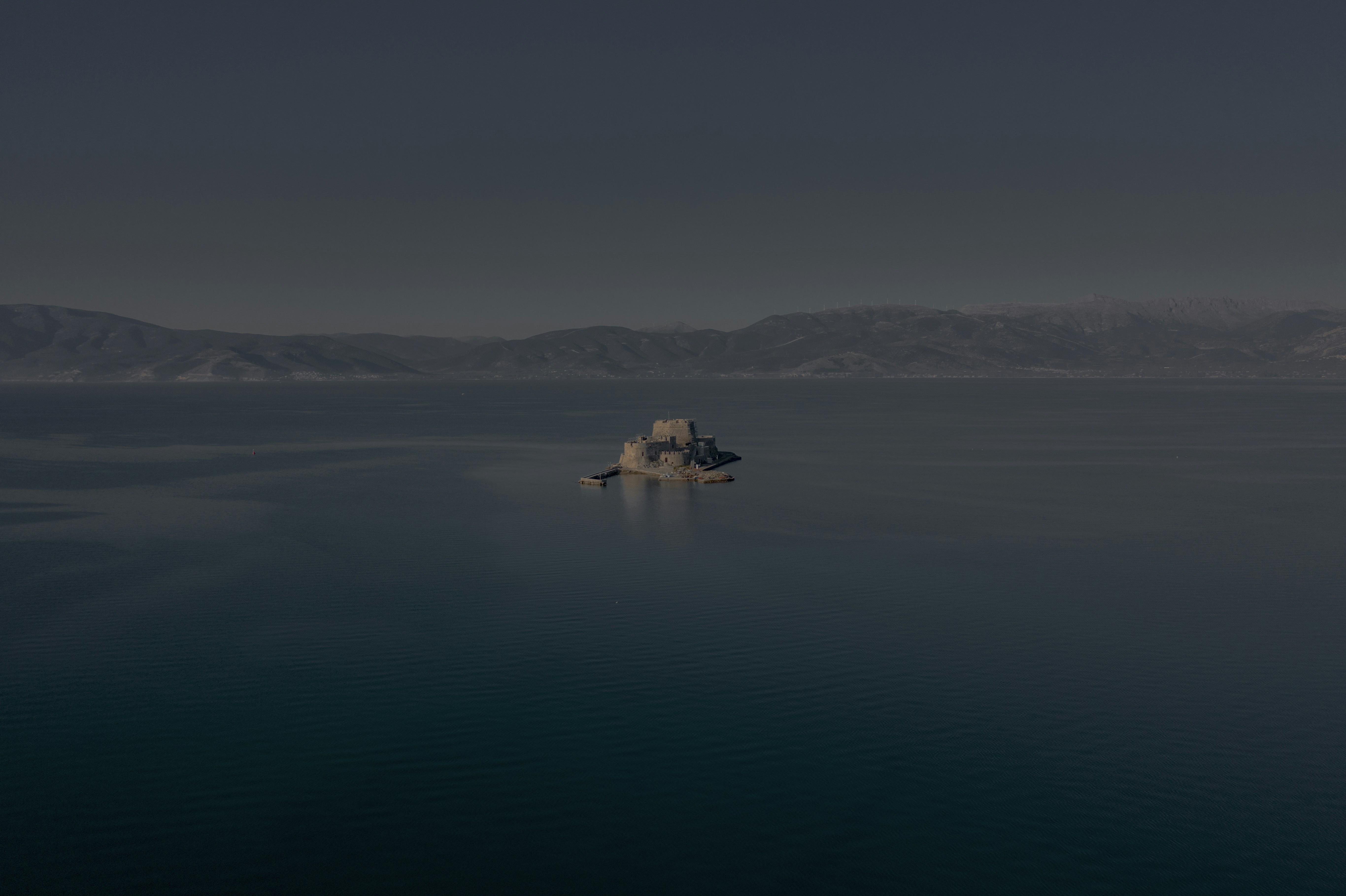 Lone Islet in a Quiet Blue Horizon