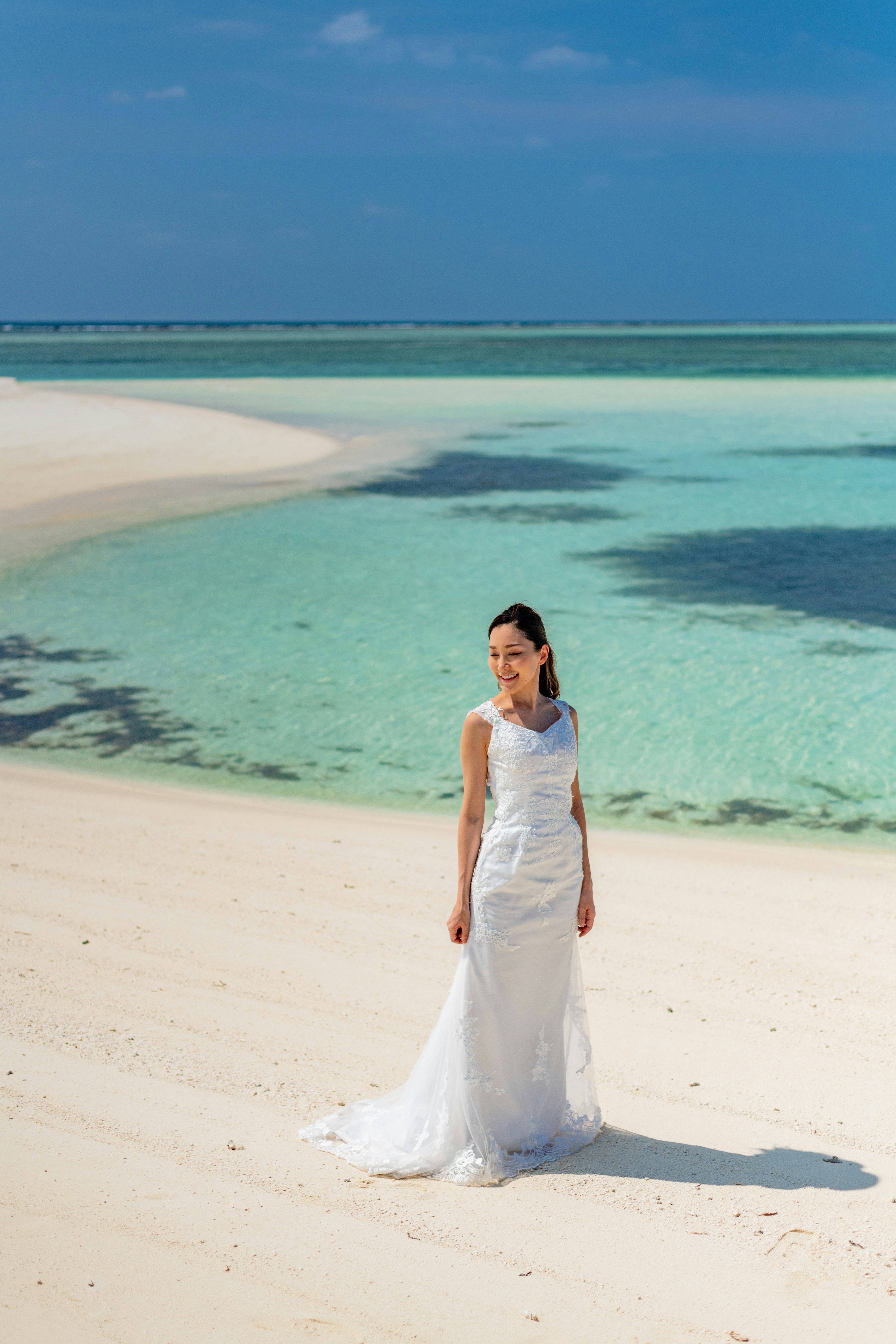Ivory Gown on a Serene Sandbar beneath a Caribbean Sky