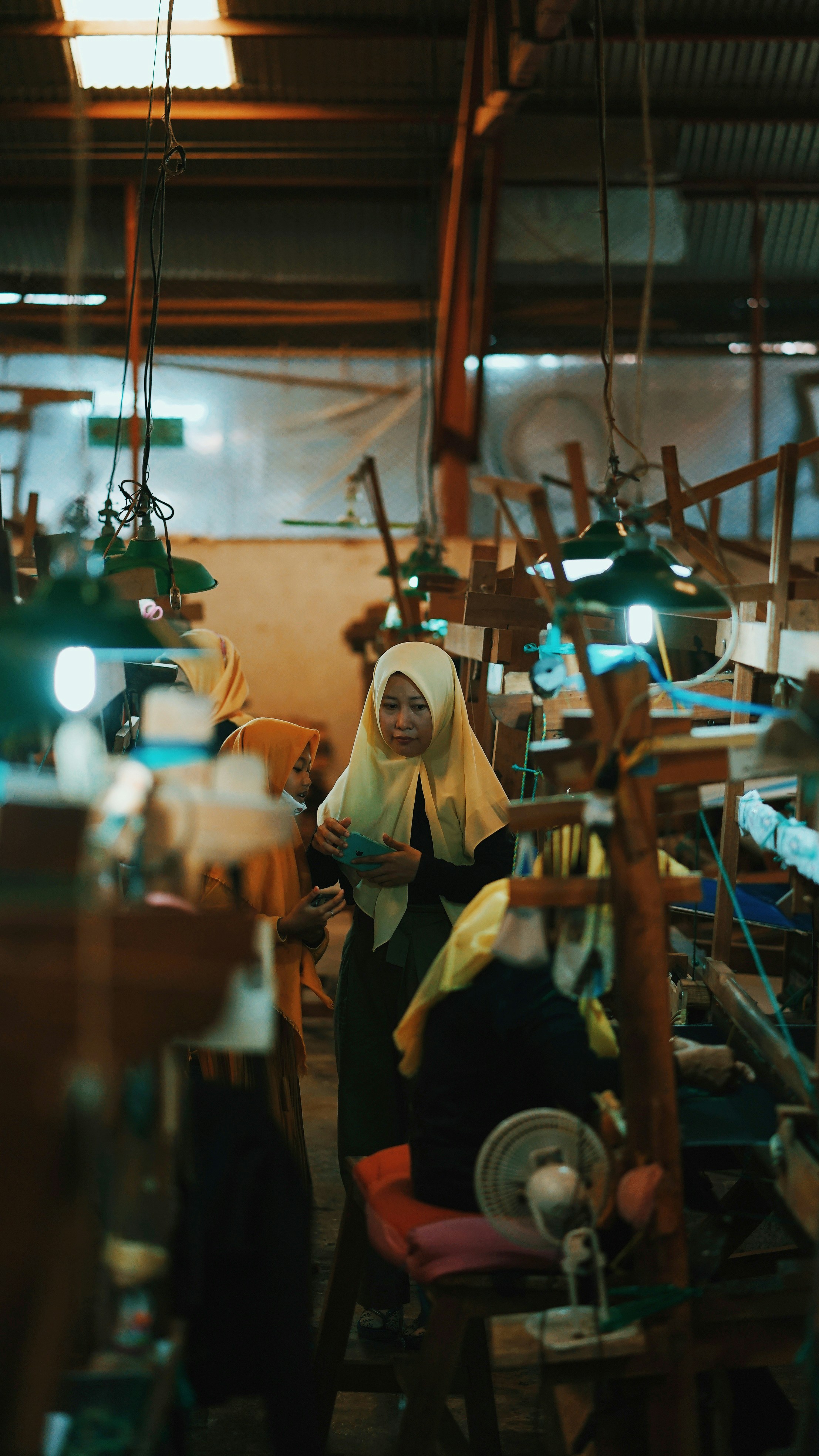 Hushed Exchange in a Loom Workshop