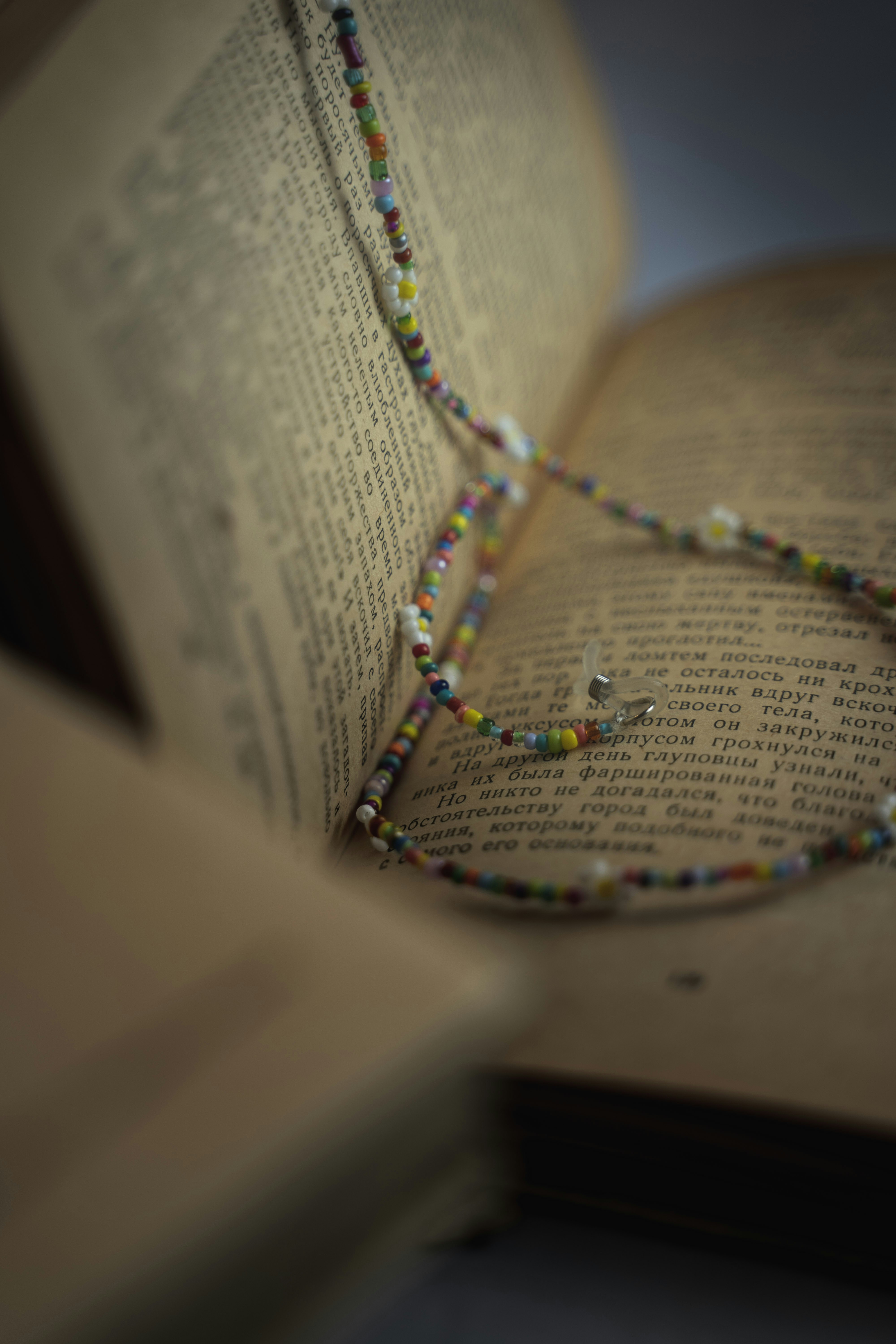 Beads Between Pages: A Colorful Thread Through Timeworn Text