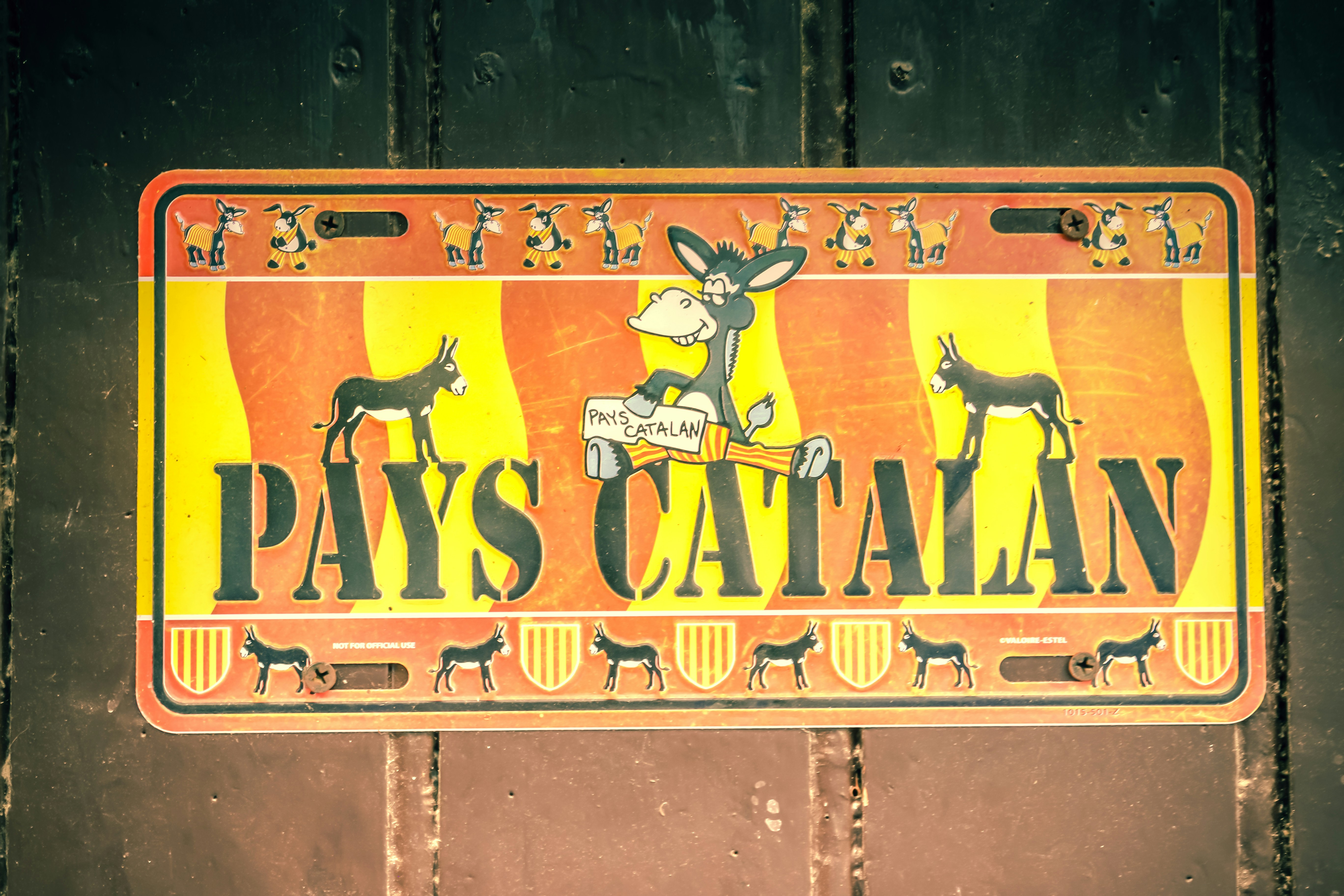 Catalan Carnival: Pays Catalan Sign with Cartoon Mascot