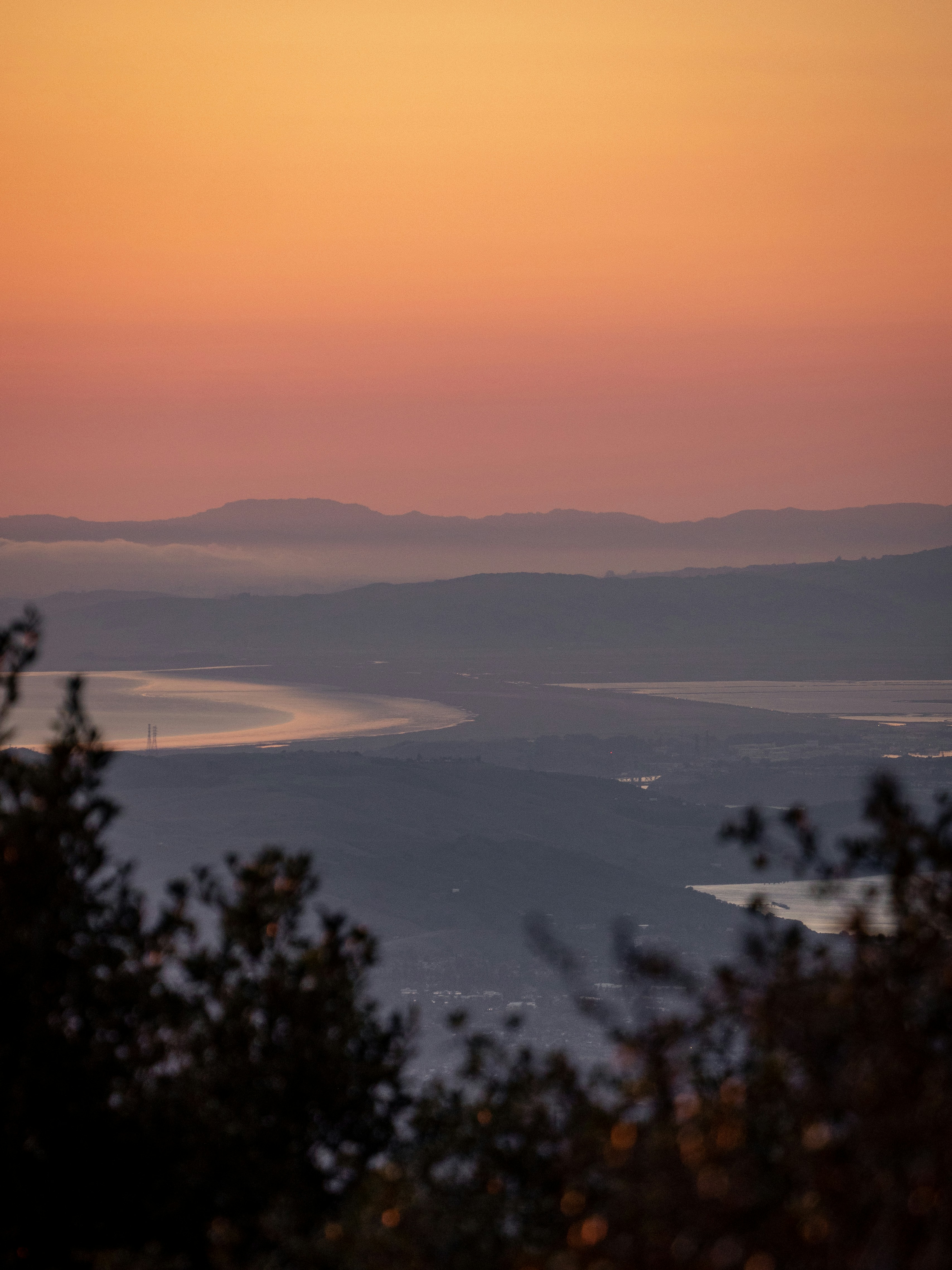 Dusk Over Velvet Valleys: The Meandering River Beneath a Golden Sky