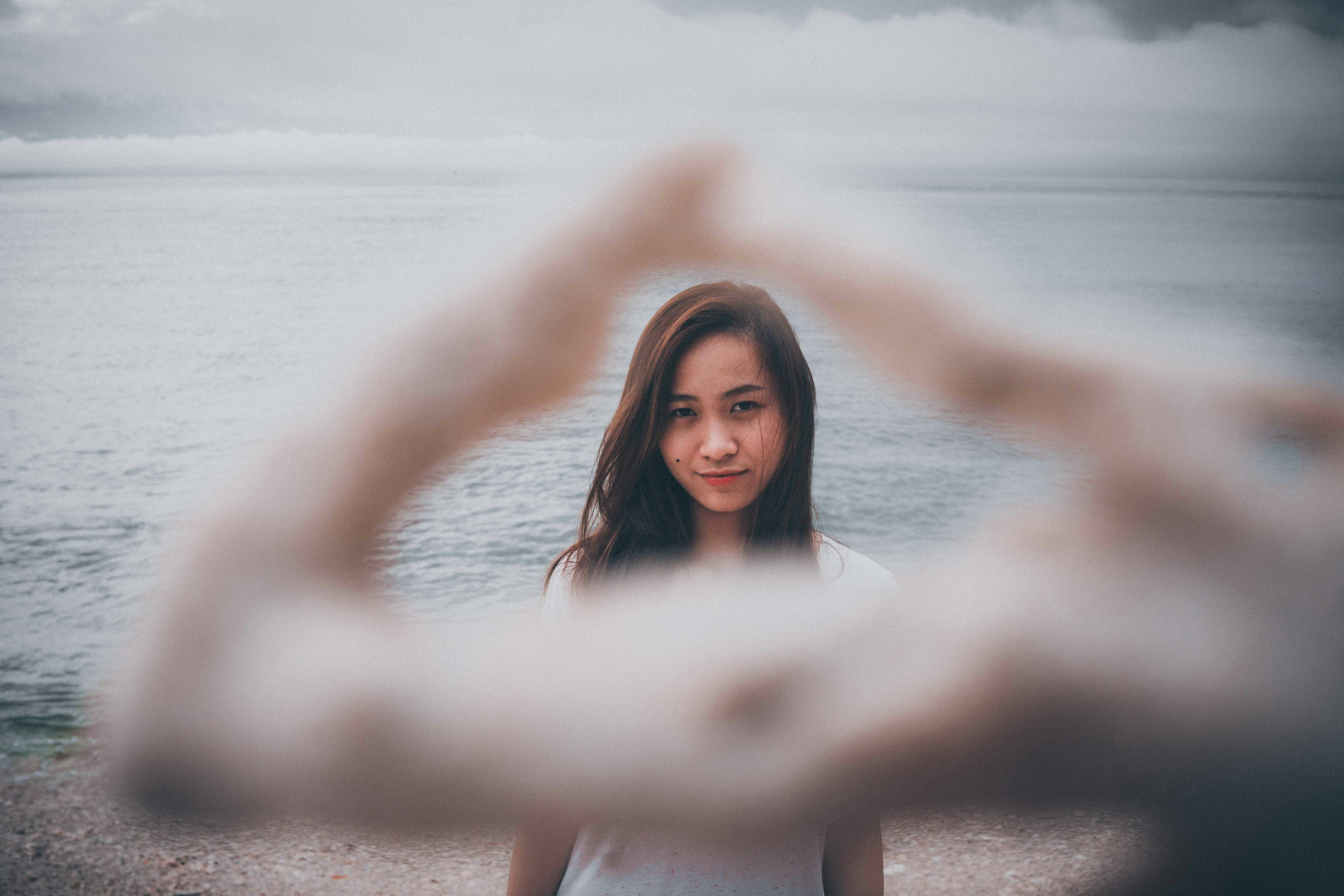 Seaside Portrait Framed by Soft Hands