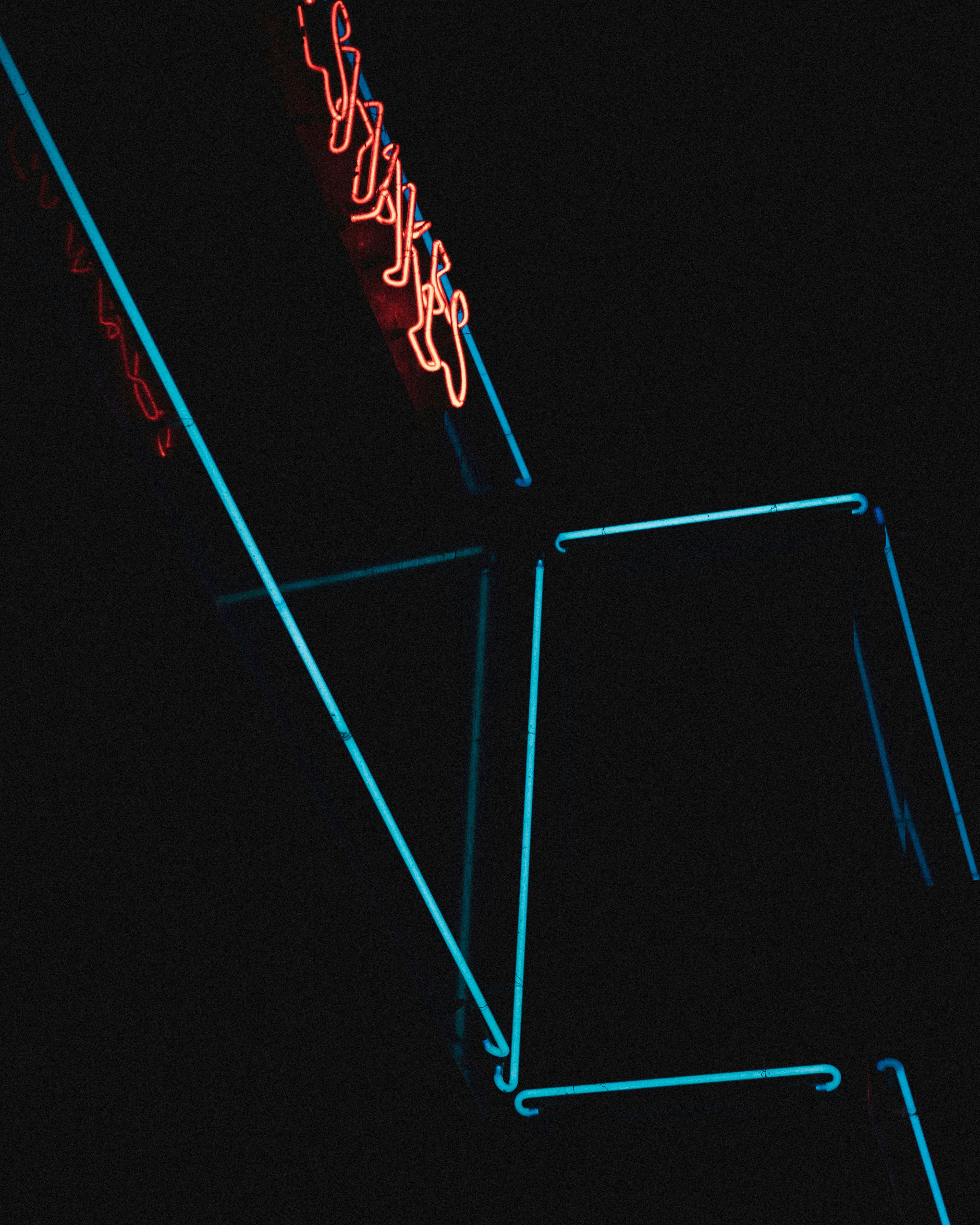 Neon Geometry in the Dark: Blue Lines Framing an Abstract Night